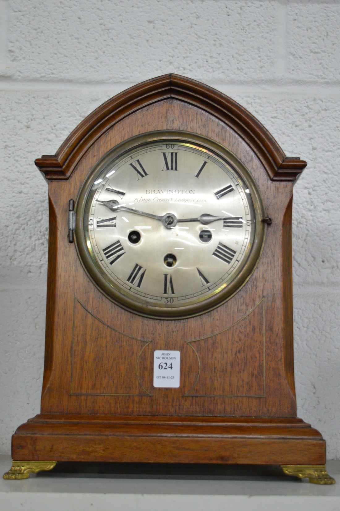 An Edwardian brass inlaid mahogany mantle clock, the dial signed ...