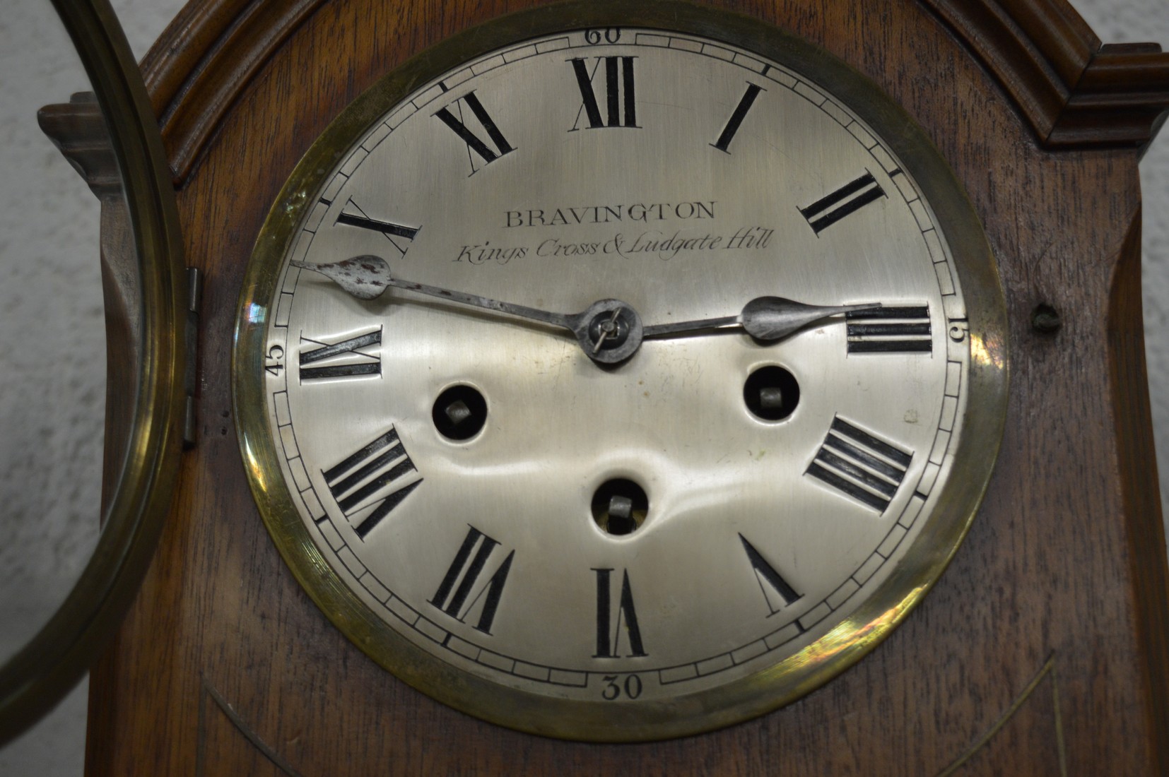 An Edwardian brass inlaid mahogany mantle clock, the dial signed ...