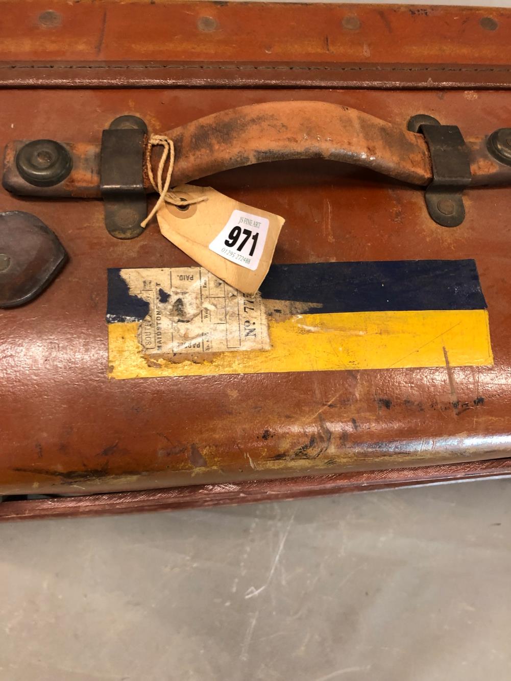 AN OSILITE SUITCASE BY H J CAVE & SONS, THE LEATHER CORNERED LID. 75 x ...