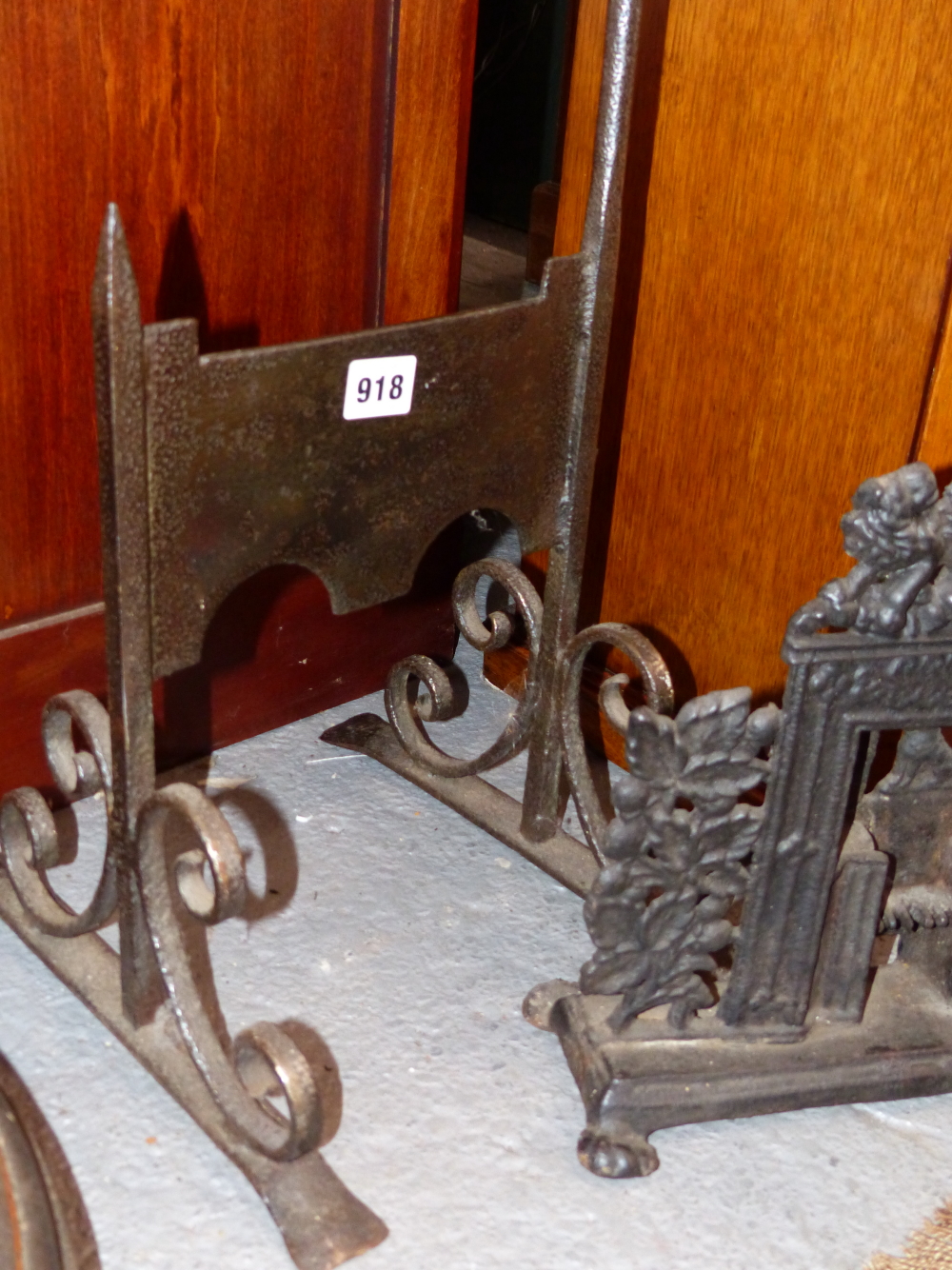 A WROUGHT IRON BOOT SCRAPER WITH A CROOK TOPPED HANDLE TO ONE SIDE AND ...