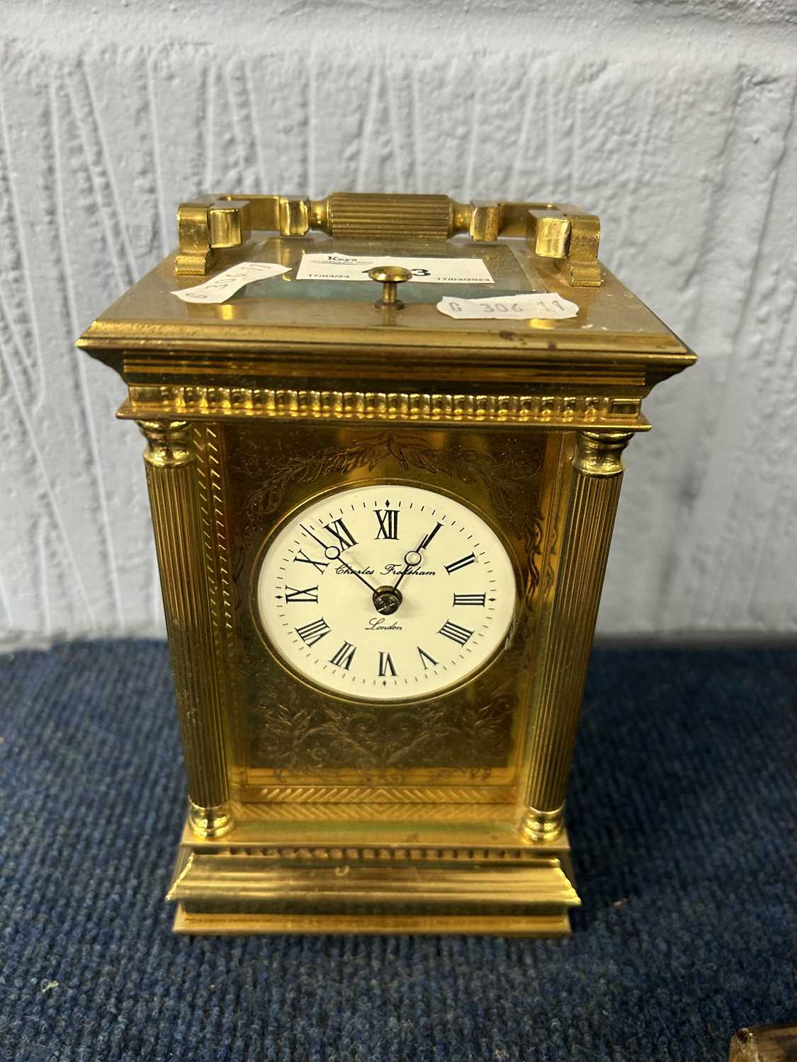 A large carriage striking carriage clock with turned columns, the dial ...