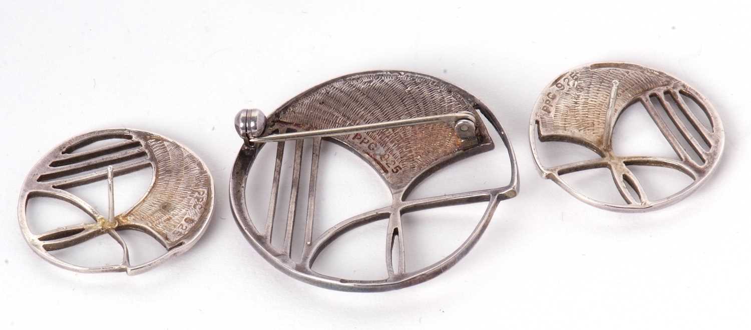 An Art Nouveau style enamelled brooch and matching earrings by Pat ...