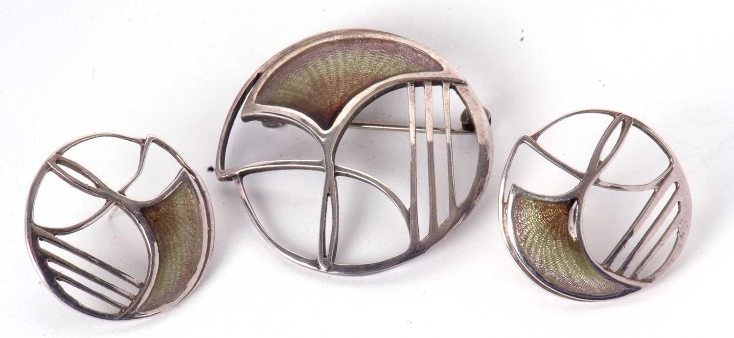 An Art Nouveau style enamelled brooch and matching earrings by Pat ...