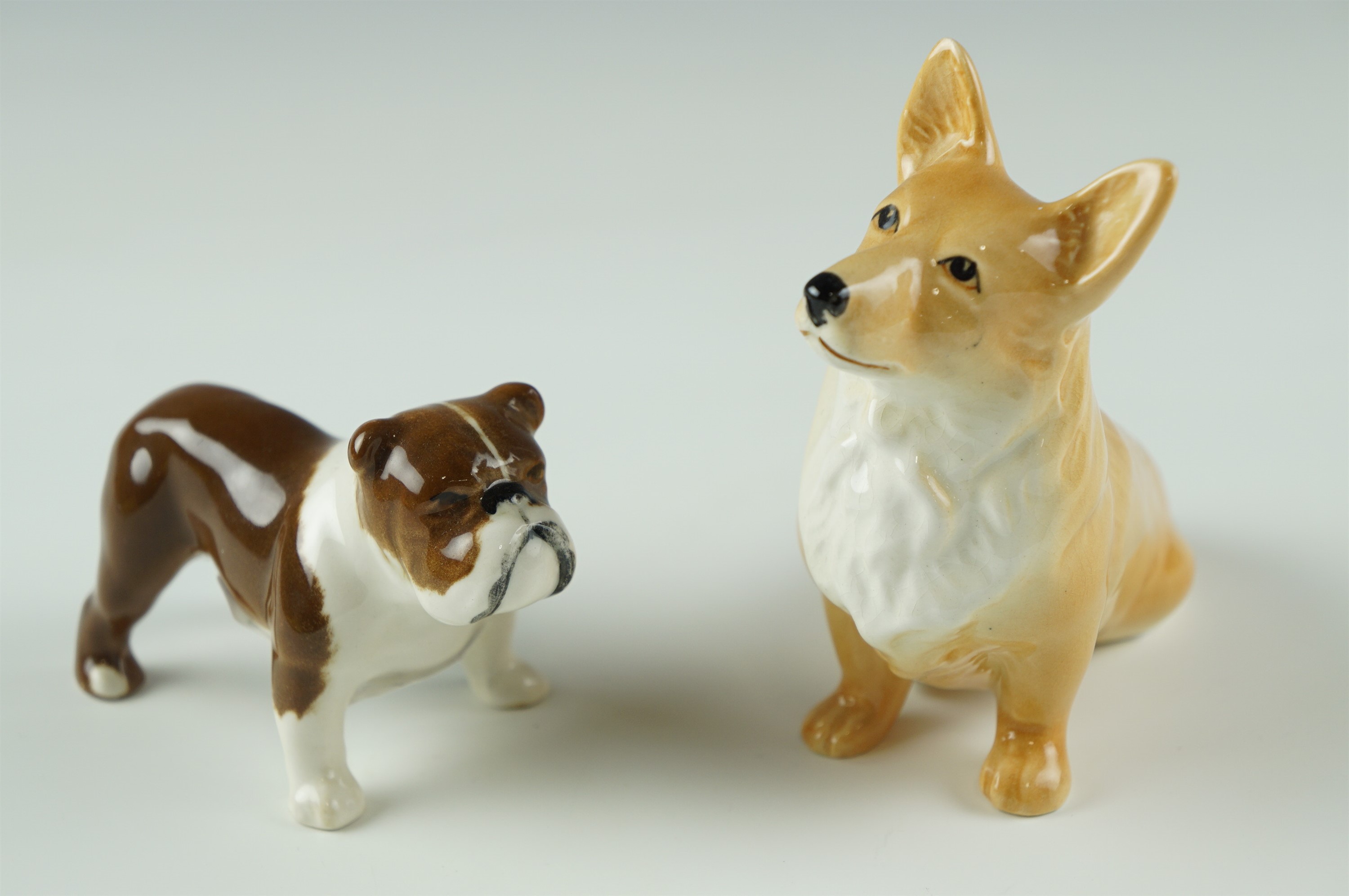 A Beswick bull dog together with a Sylvac Corgi, 11 cm tallest