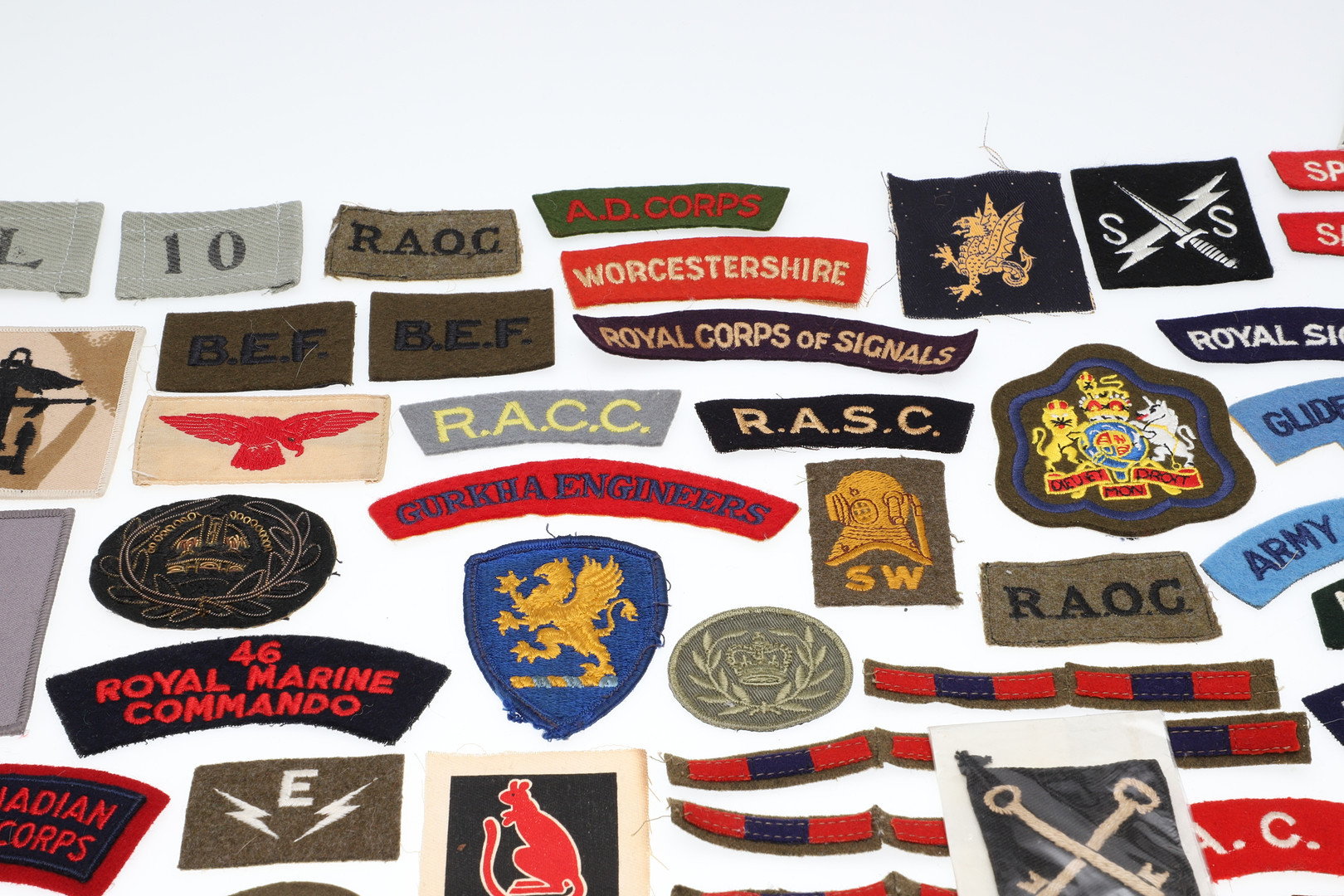 A large collection of fabric patches to include shoulder titles for the ...