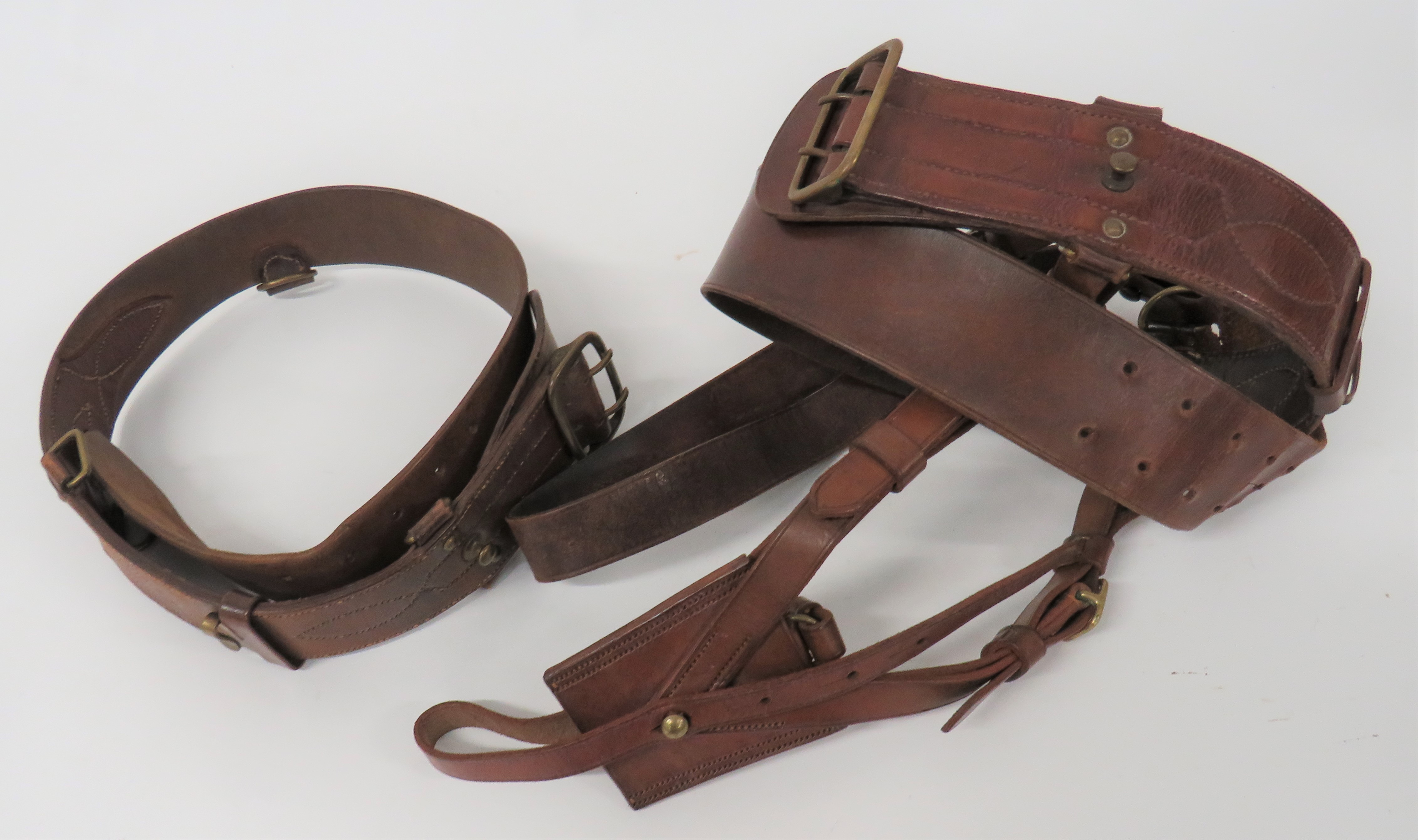 Two Officer Sam Browne Beltsconsisting brown leather belt with brass ...