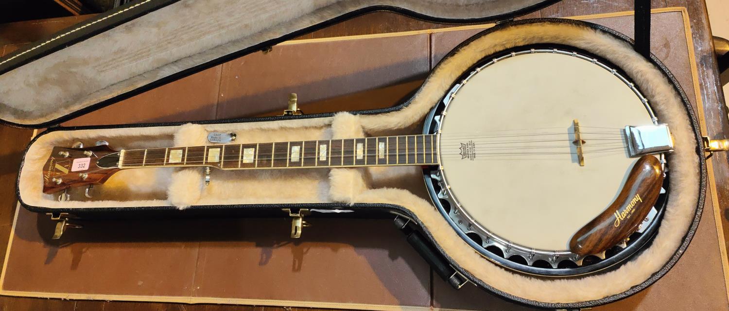 A Harmony 5 string banjo in hard case