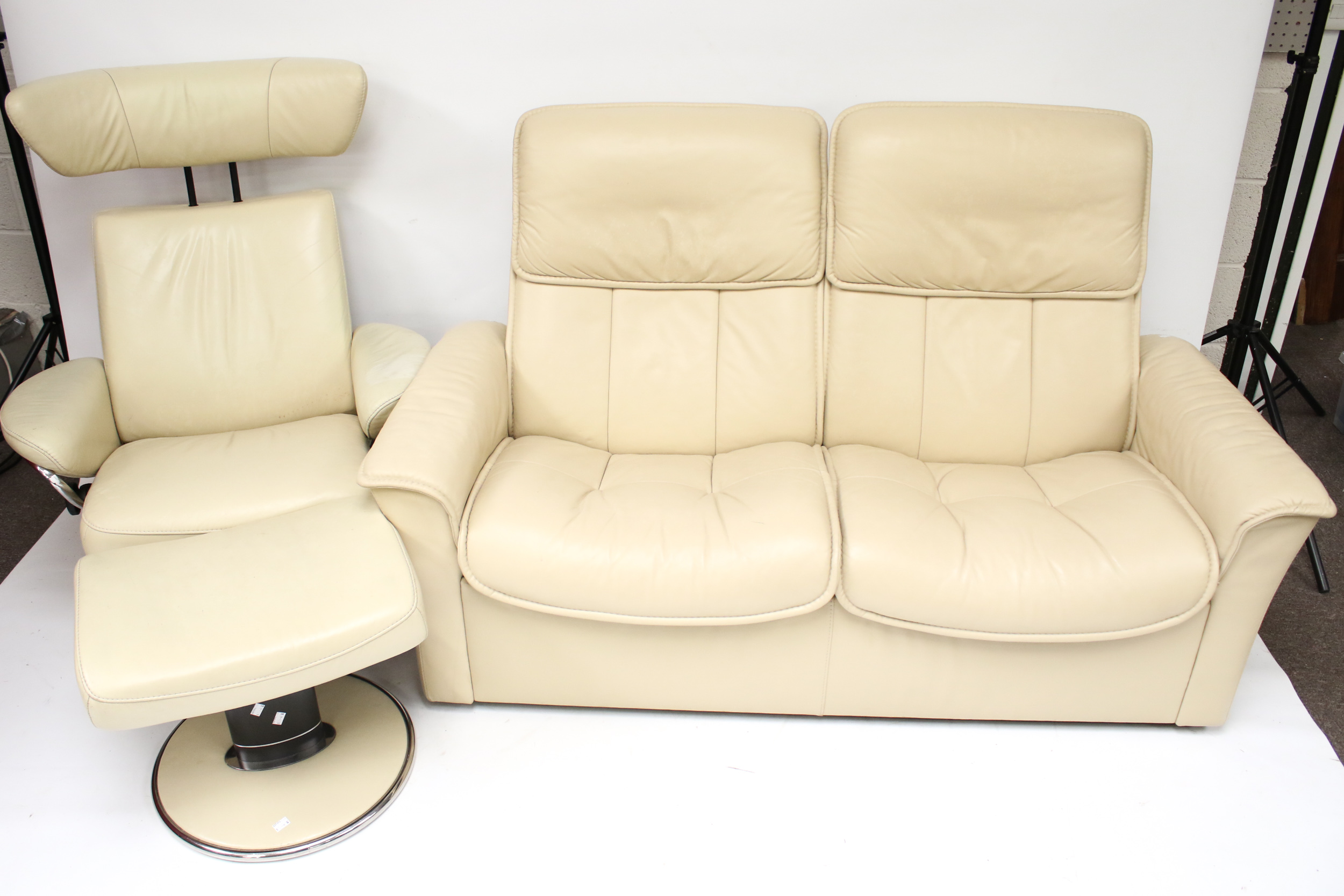 A Stressless cream three piece lounge suite. Including a two seater ...