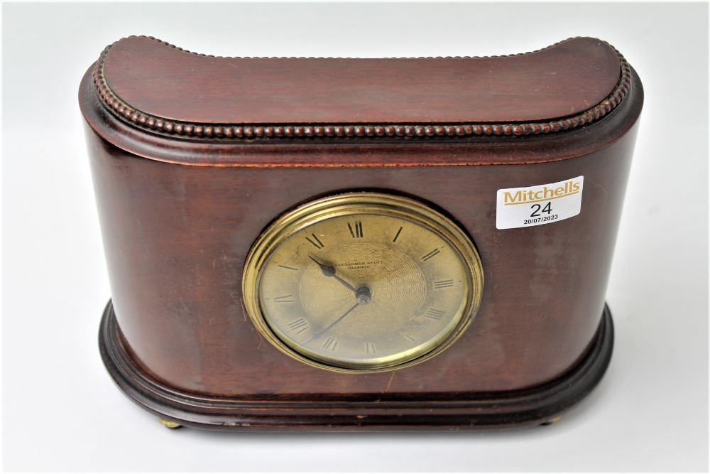 Curved wooden mantle clock by Alexander Scott of Glasgow