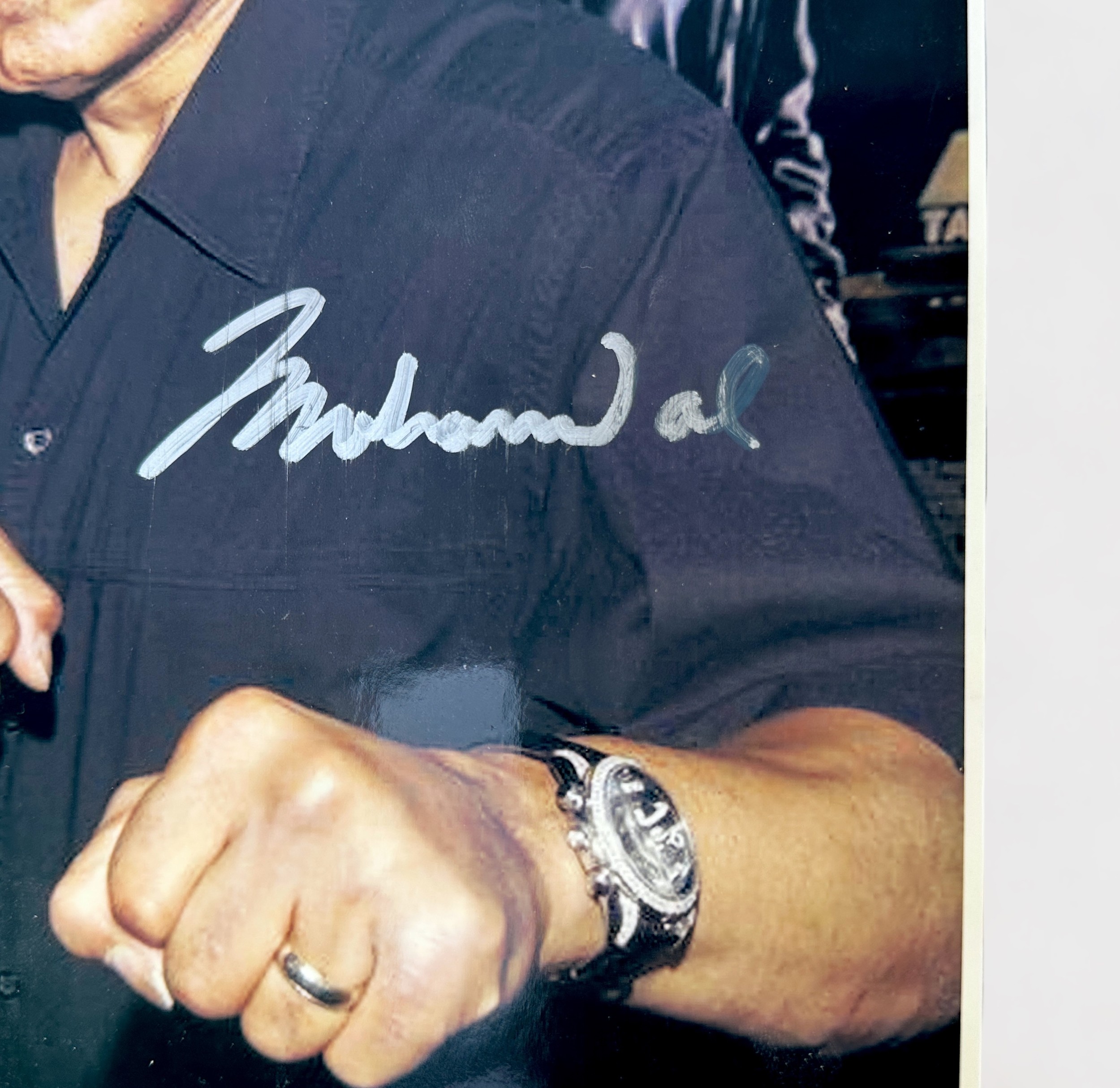 A small collection of assorted signed Muhammad Ali items including a ...
