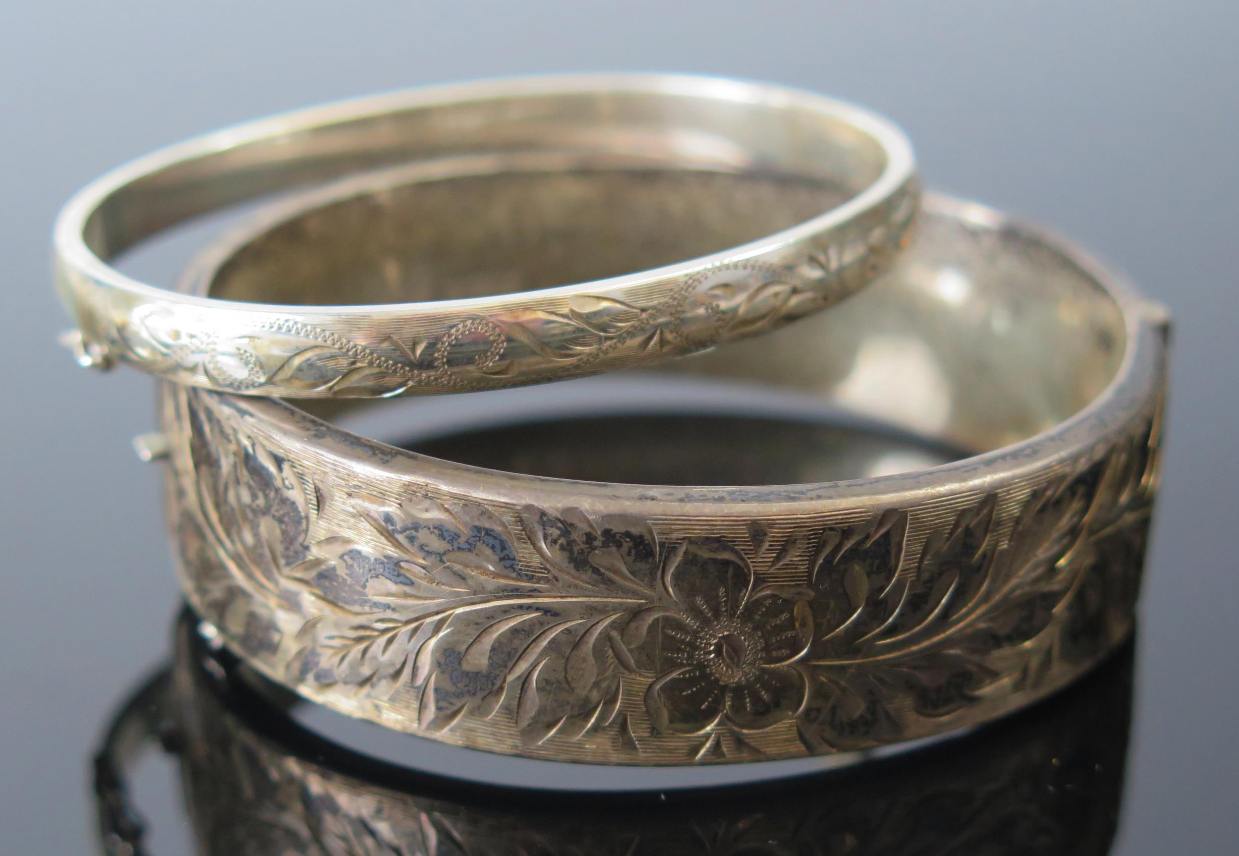 A Modern Silver Hinged Bangle with chased foliate decoration ...