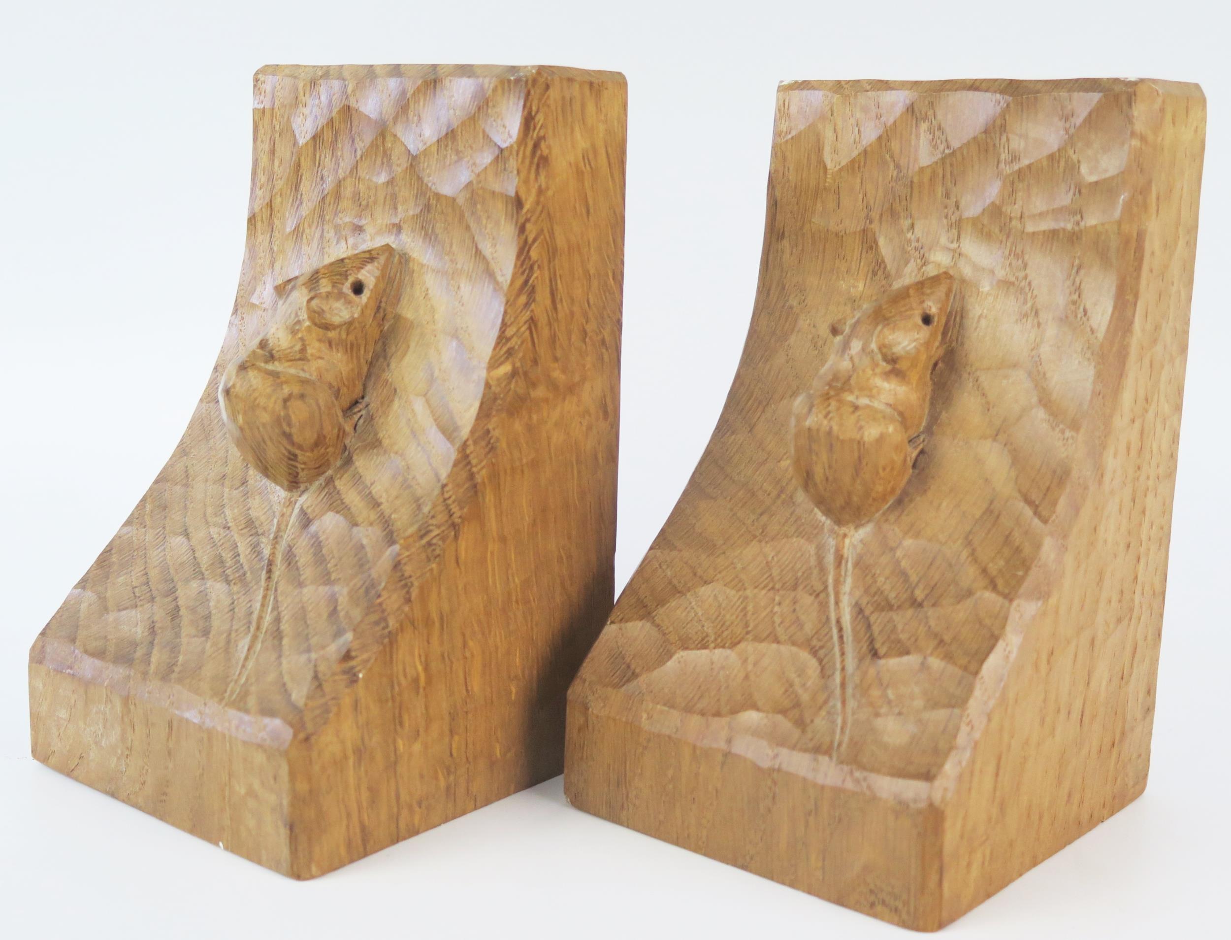 A pair of "Mouseman" chip carved pair of oak bookends, 15.5cm high.