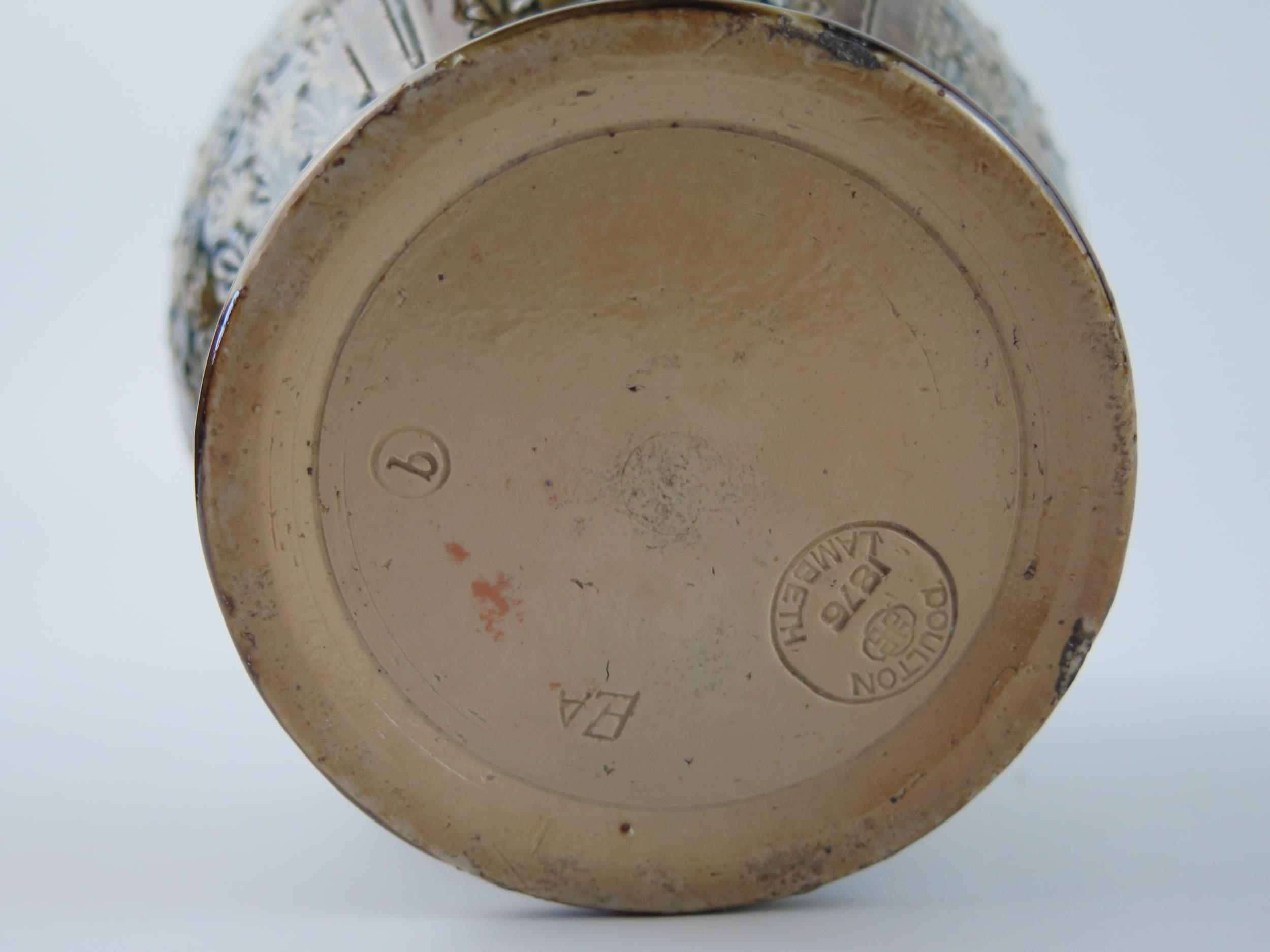 A Doulton Lambeth ware mask jug, of ovoid form, with impressed foliate ...
