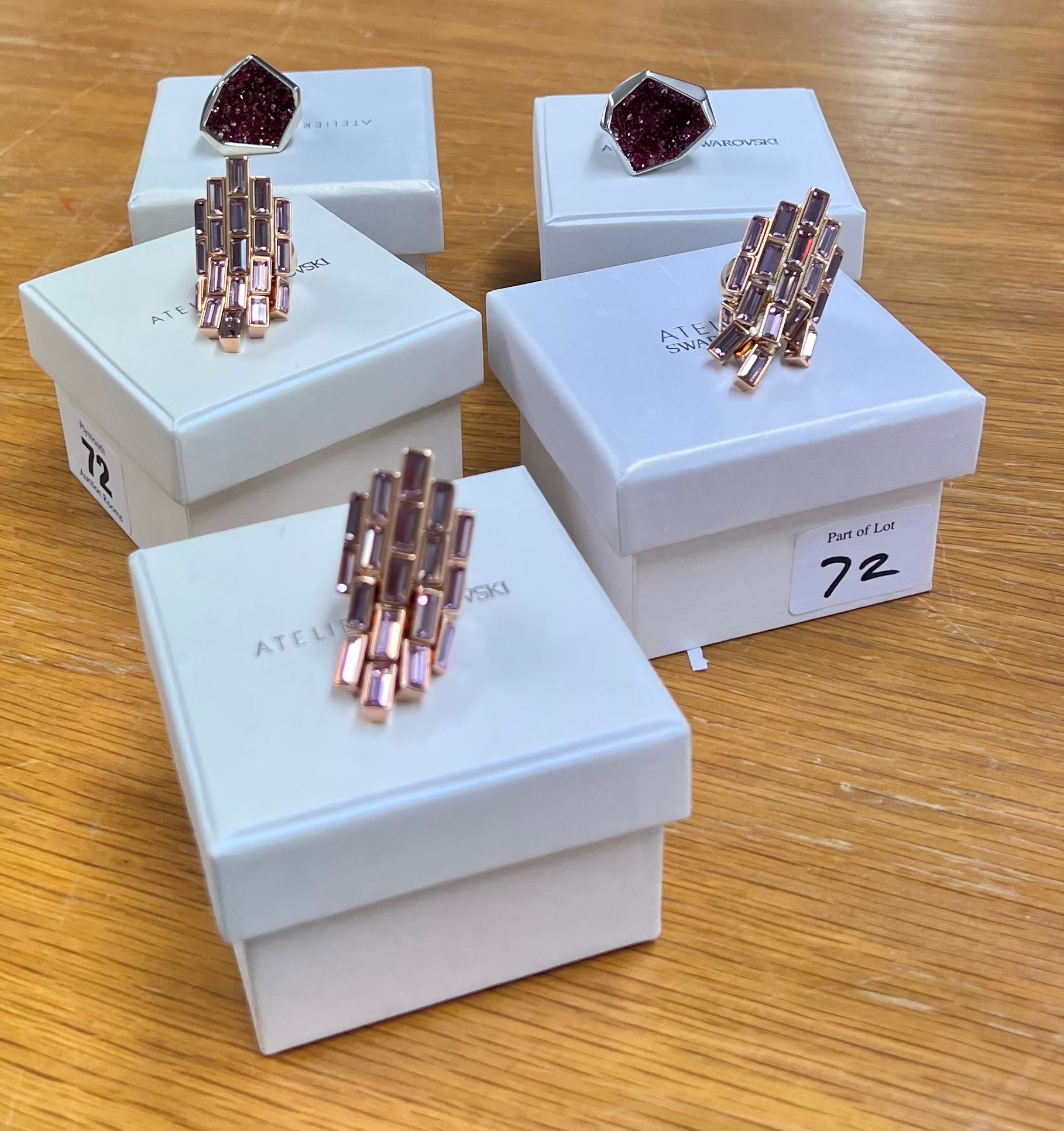 Swarovski Atelier, Collection of five rings, three rose gold coloured ...