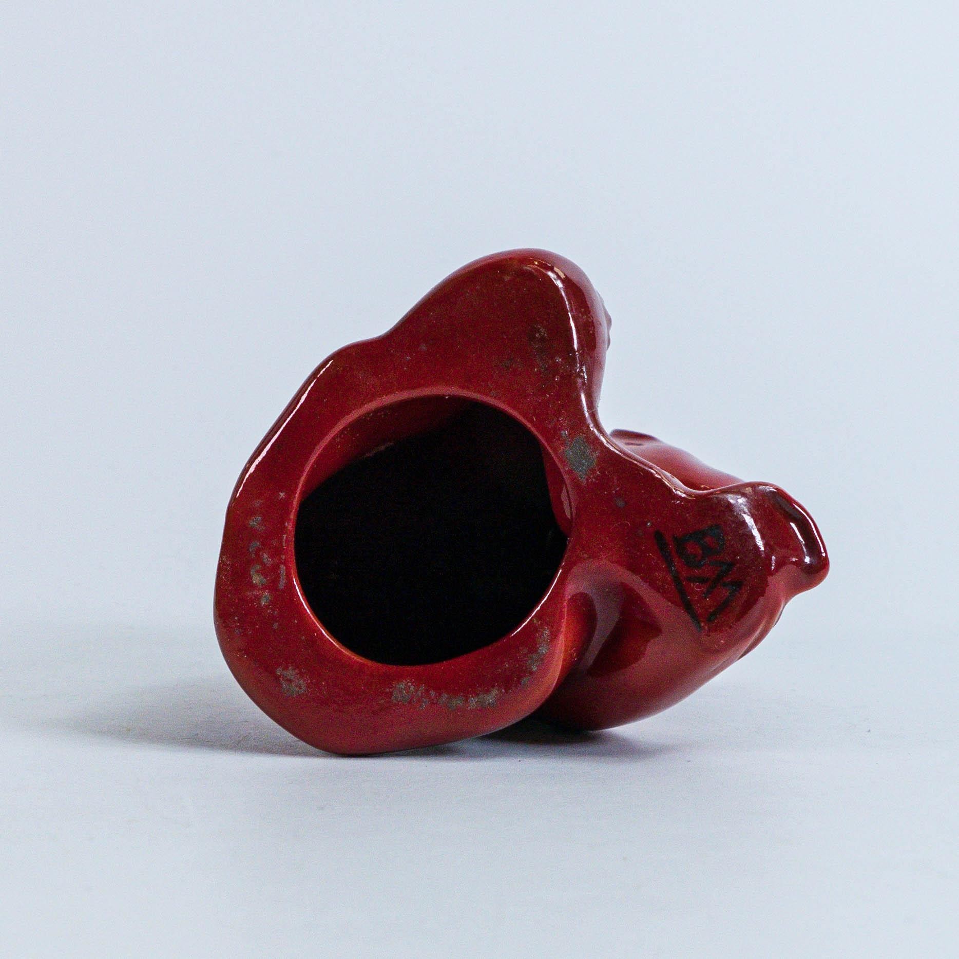 Bernard Moore seated monkey in a red Flambe glaze, height 8cm