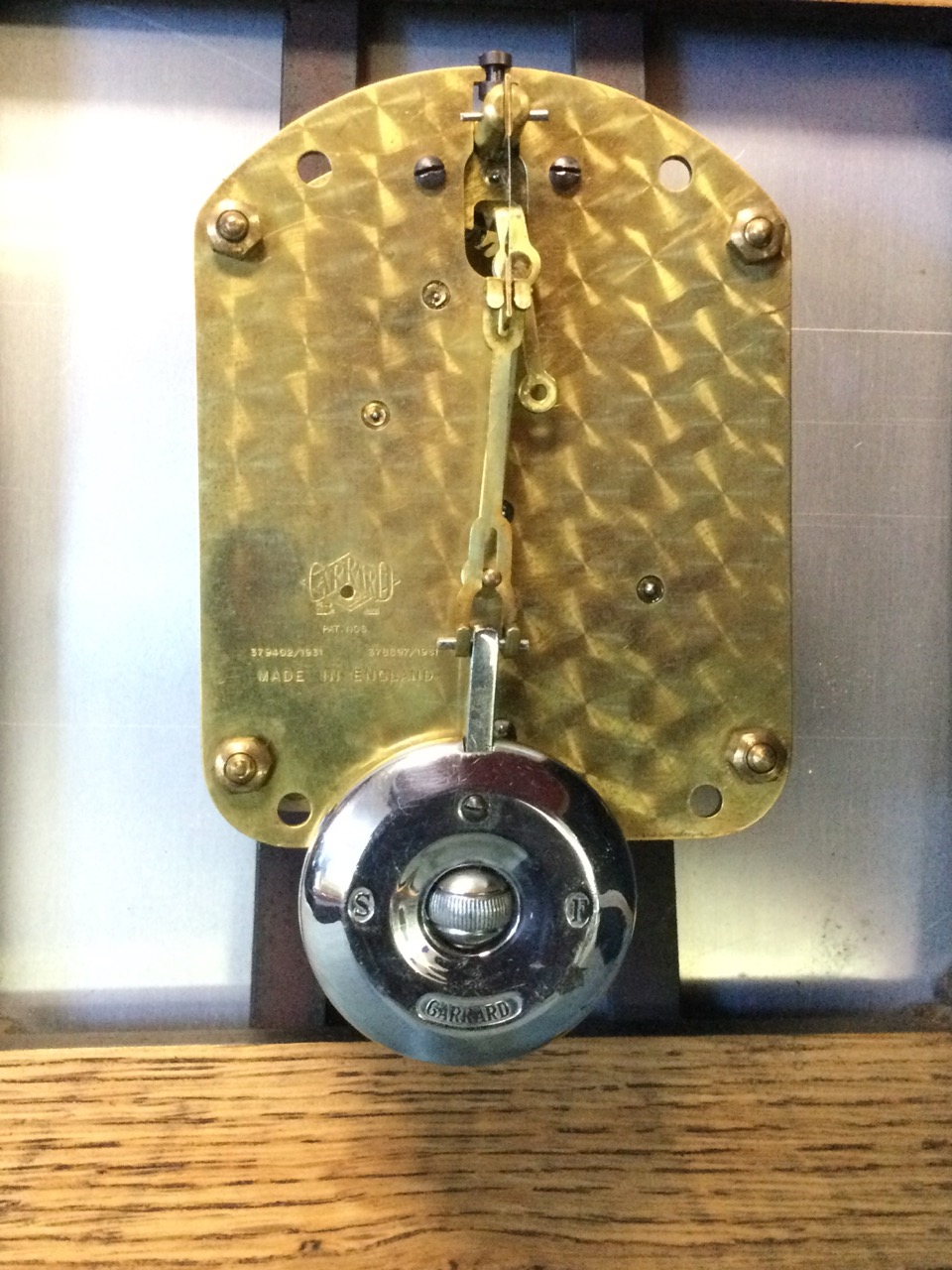 An Edwardian circular oak wall clock by Garrard, the 10in dial with ...