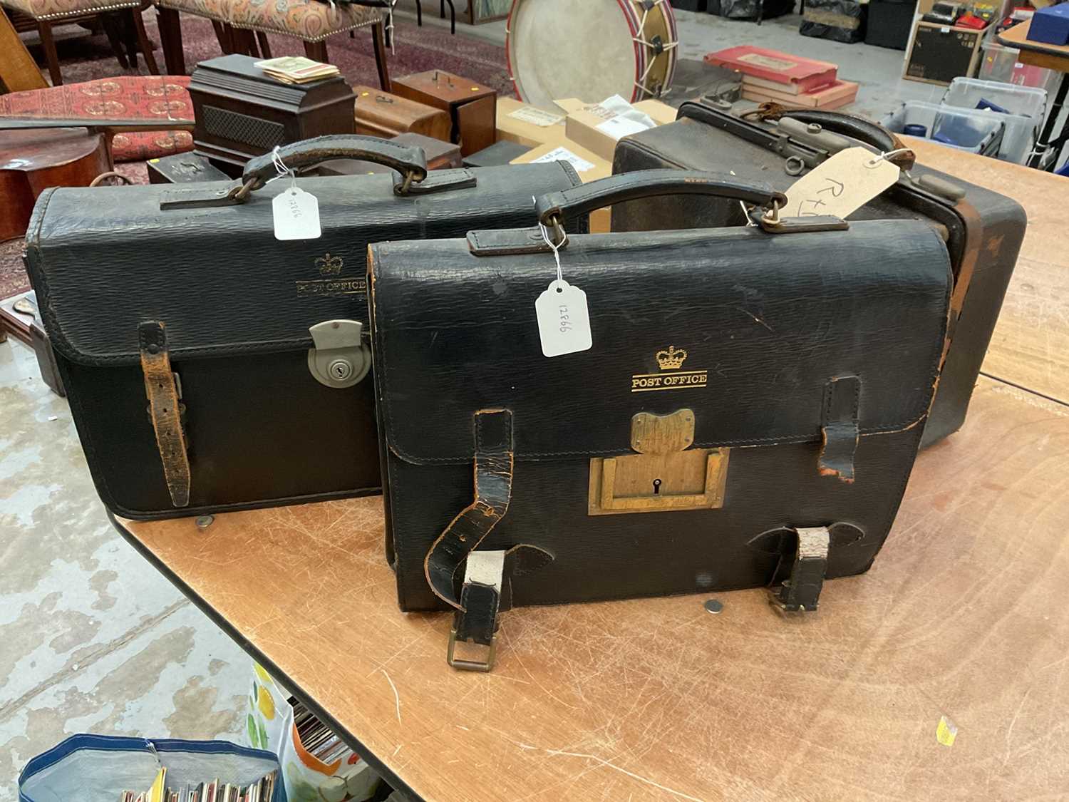 Two vintage leather Post Office satchels, together with a leather ...