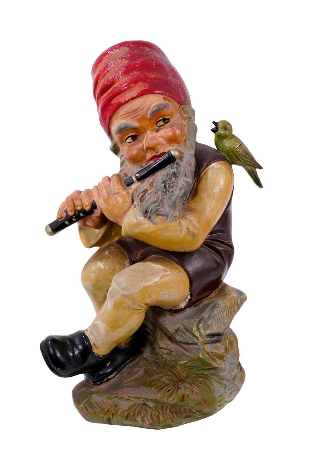 Austrian terracotta garden gnome, seated playing a flute, with ...
