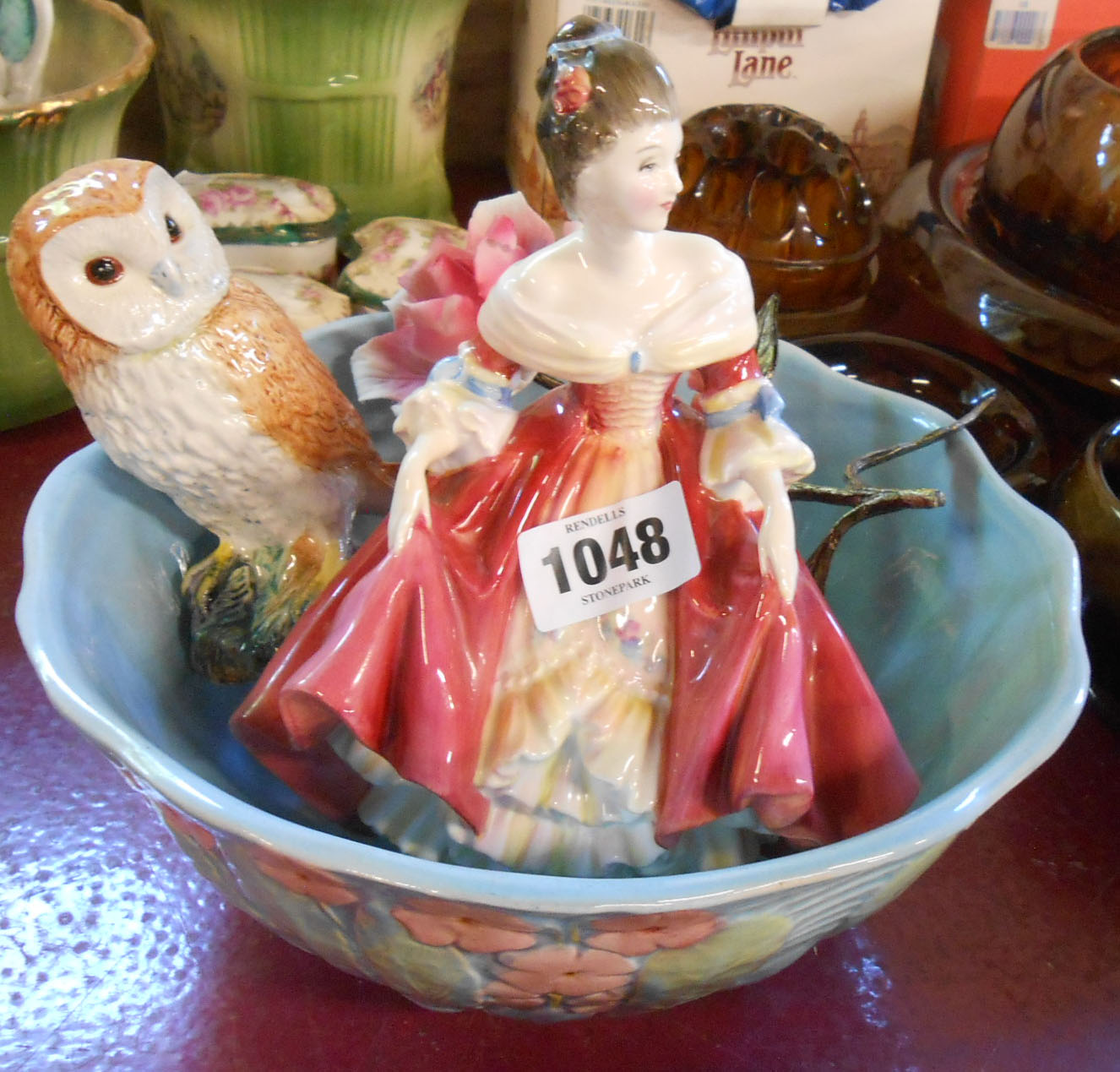A Royal Doulton bone china figurine Southern Belle HN2229, a Beswick ...