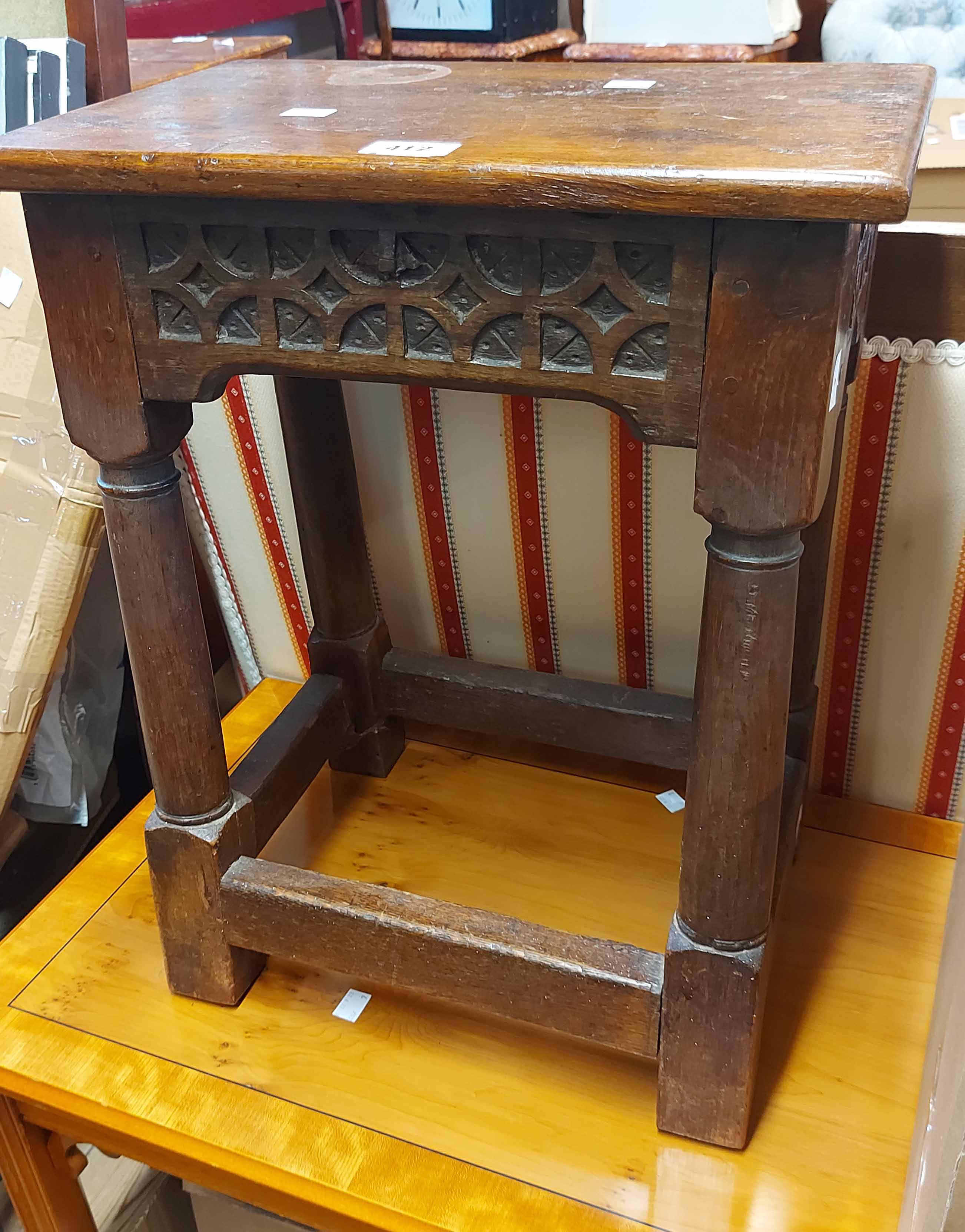 An antique oak coffin stool with decorative carved blind fretwork apron ...