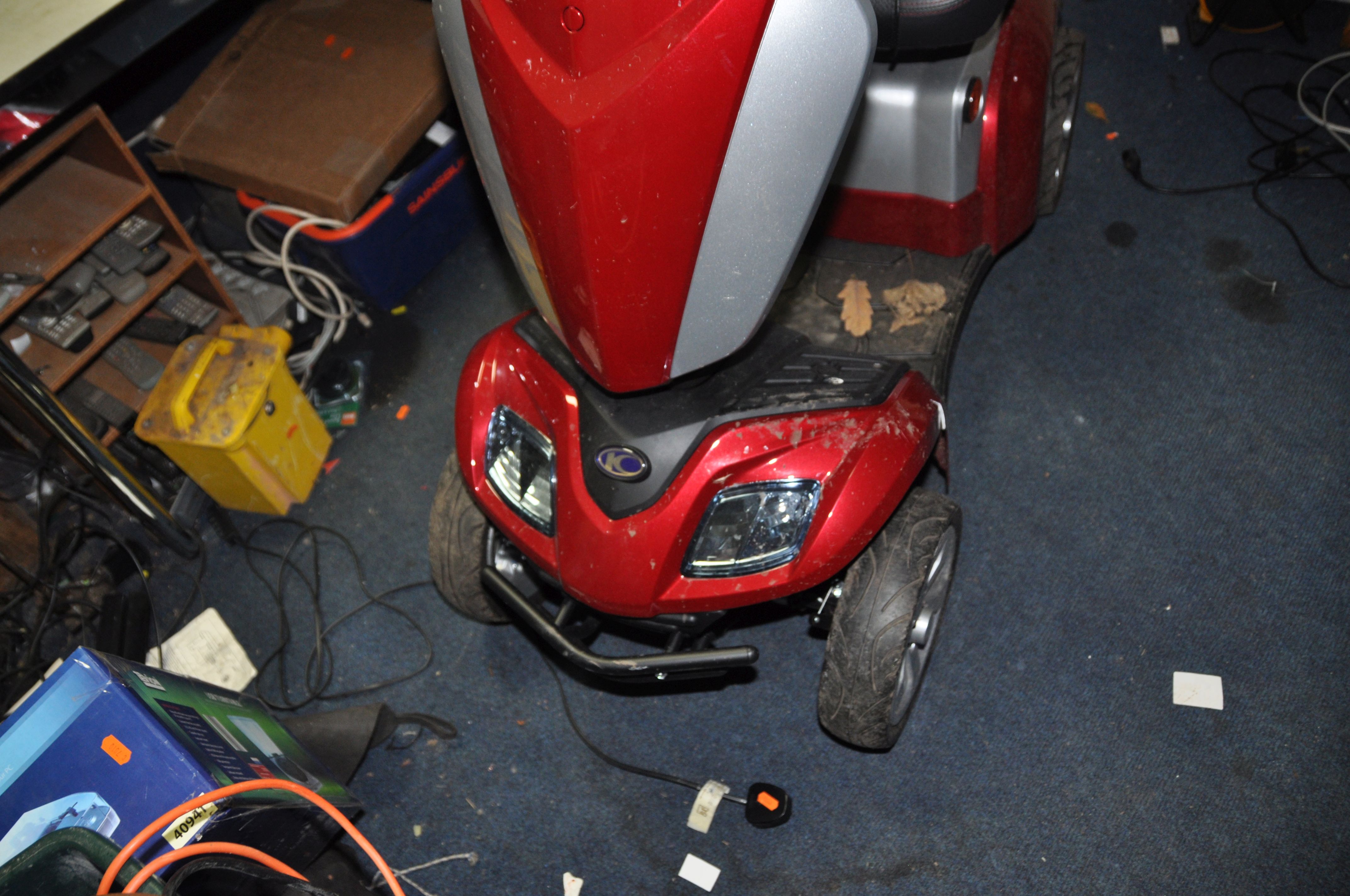 A KYMCO FOUR WHEELED MOBILITY SCOOTER with one key, charger, front and ...