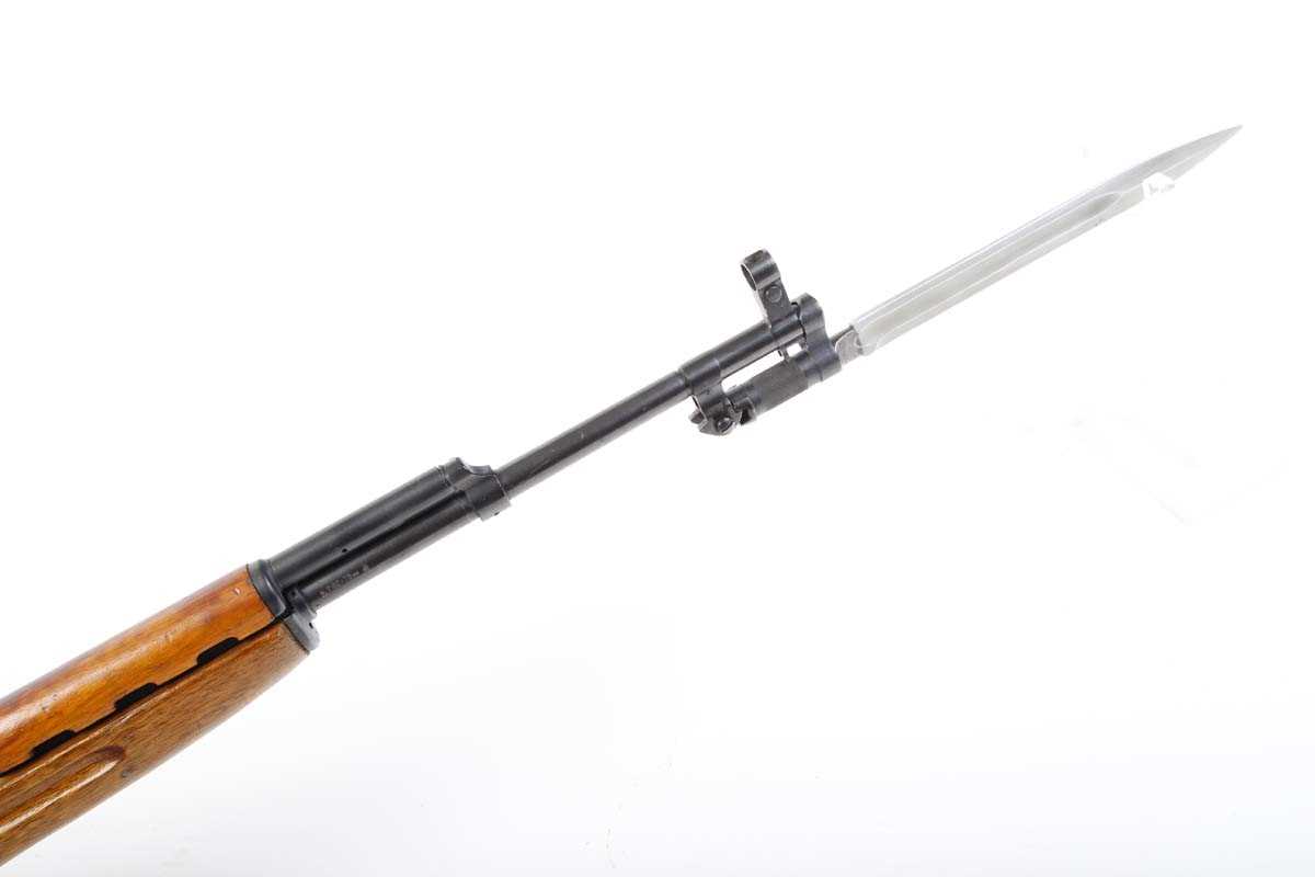 A deactivated 7.62 x 39mm SKS semi-automatic rifle, with barrel-mounted ...