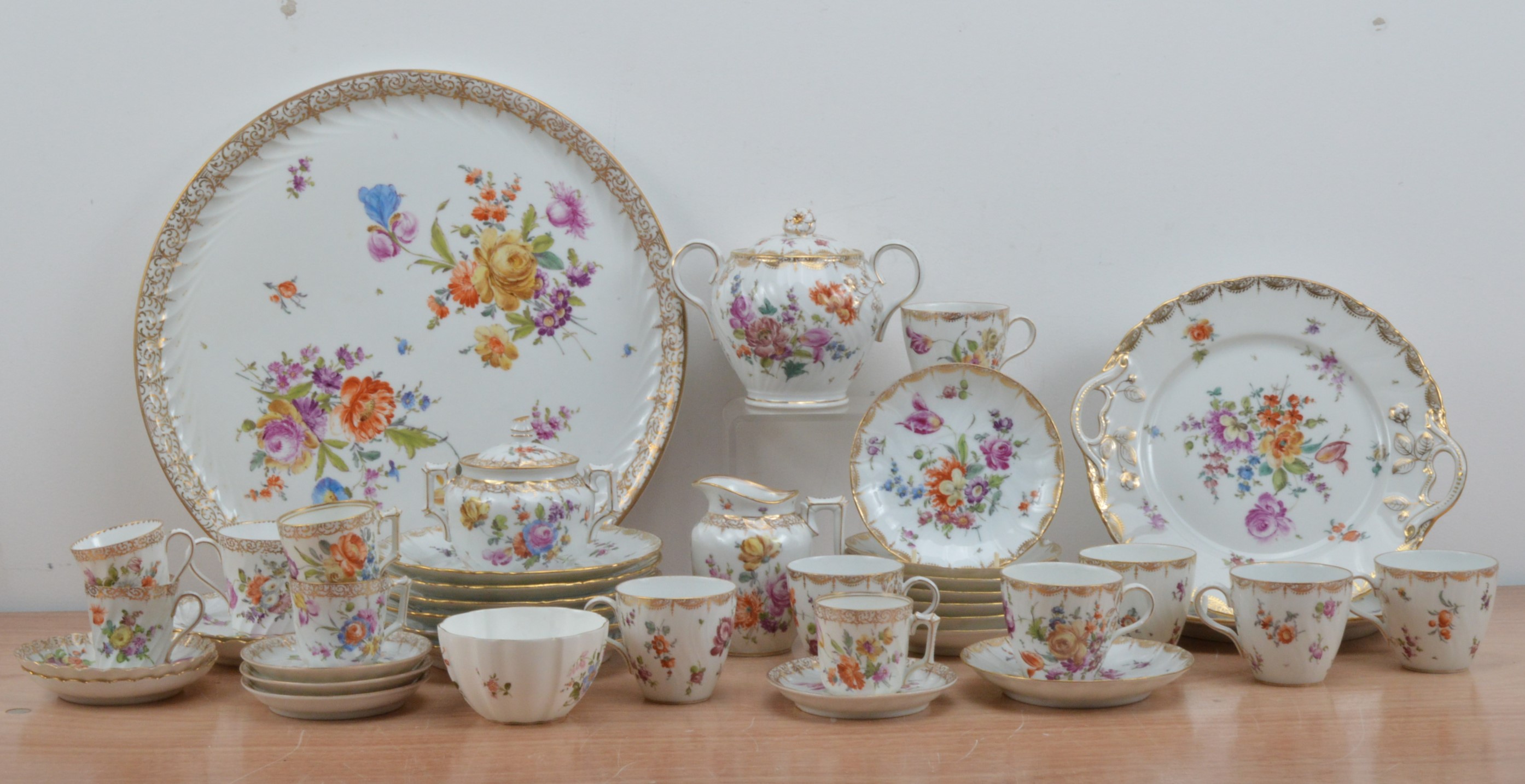 A collection of Dresden porcelain tea wares, some marked 'Dresden' and ...