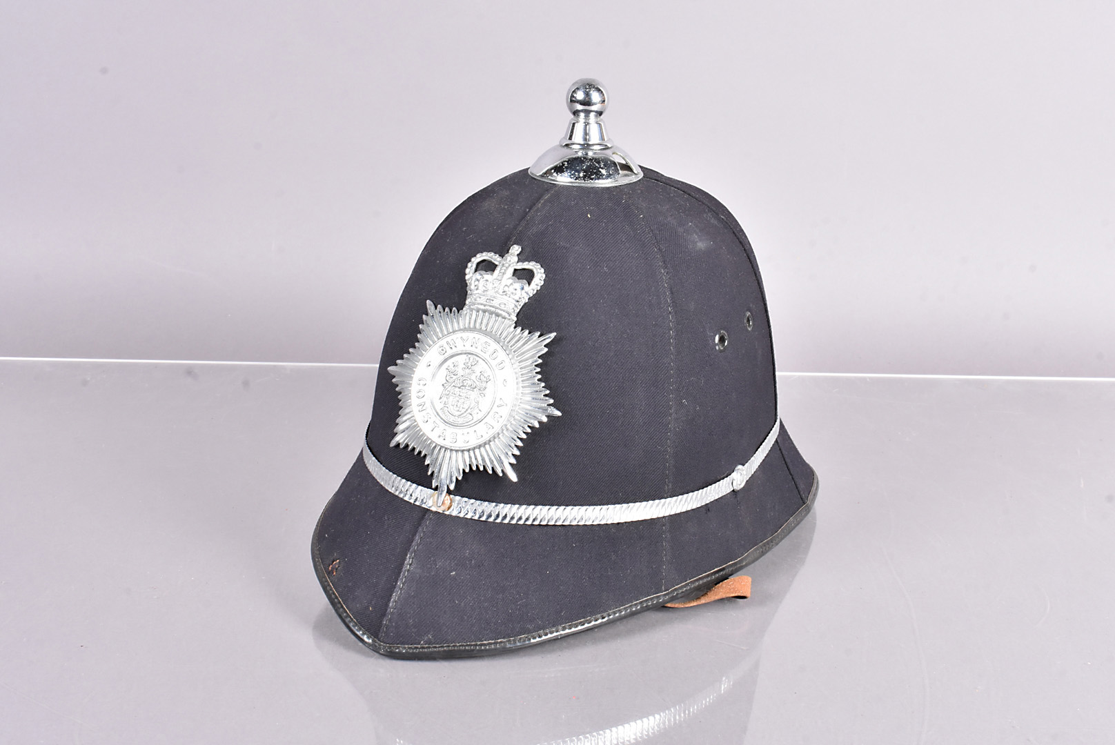 A 1970s Ball Top Police helmet, with Gwynedd Constabulary helmet plate ...