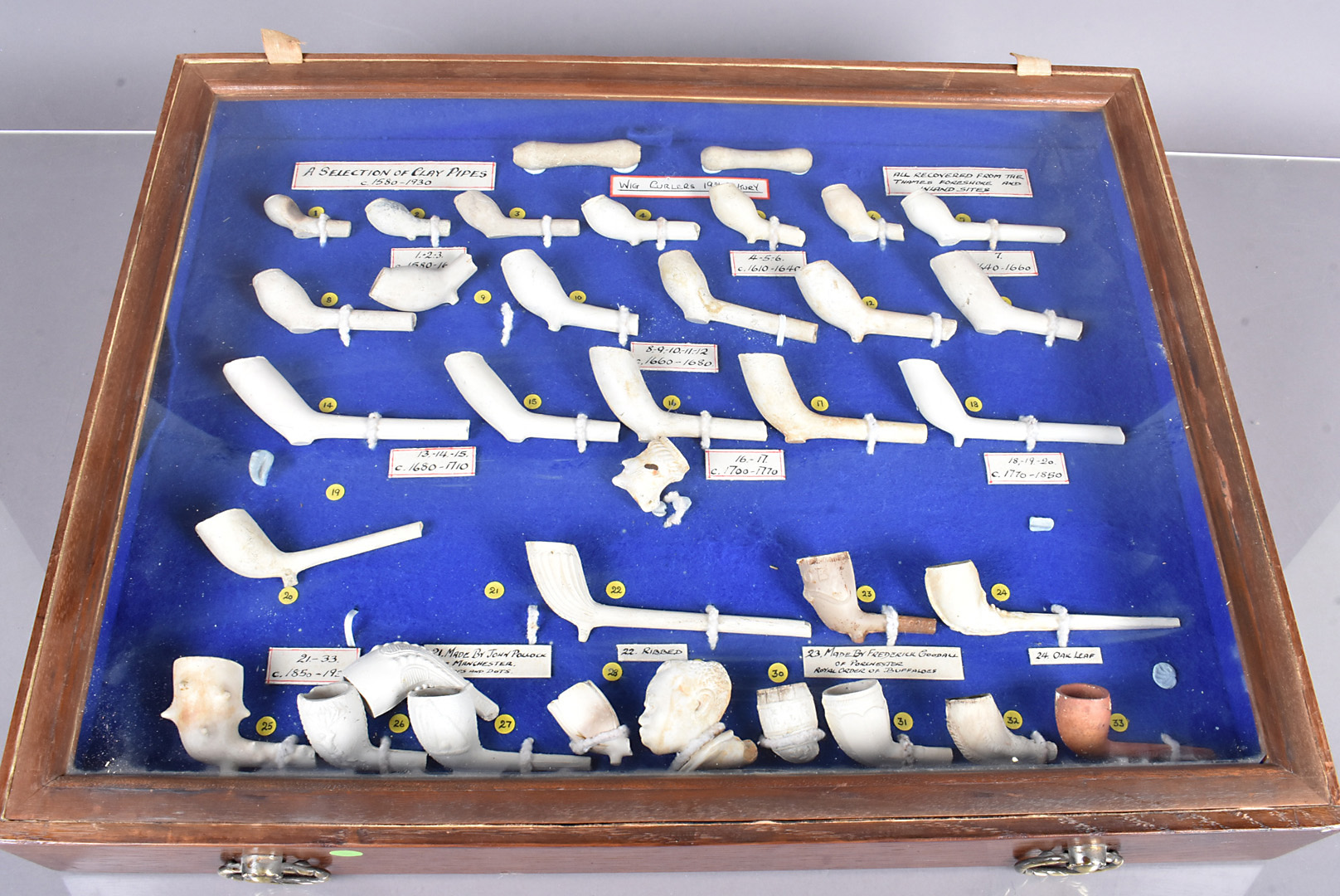 a well presented collection of 16th Century and later clay pipes ...