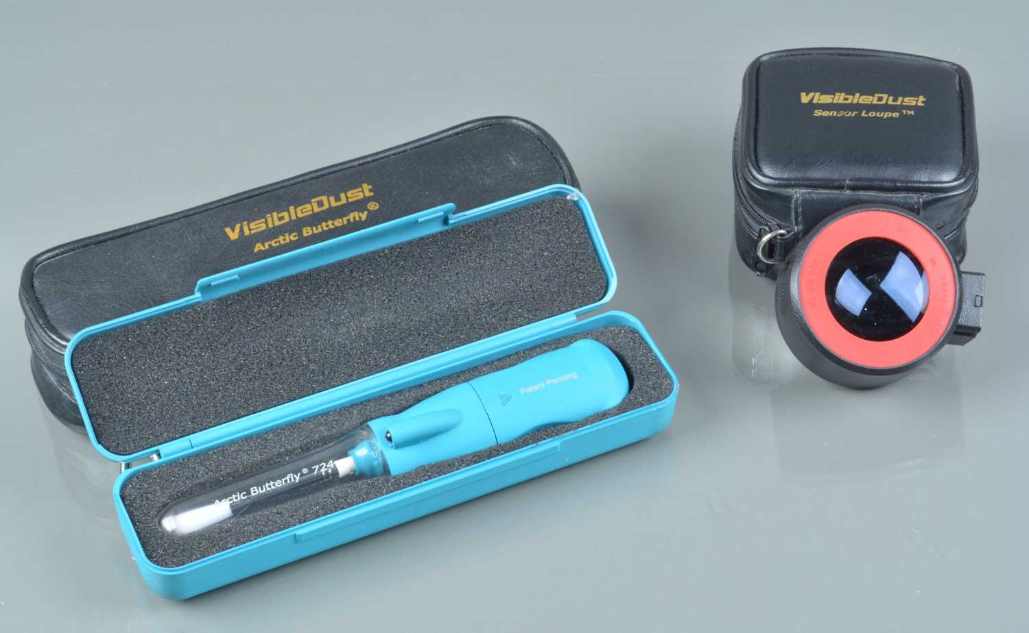 A Visible Dust Sensor Loupe, untested, in case with a cased Visible ...