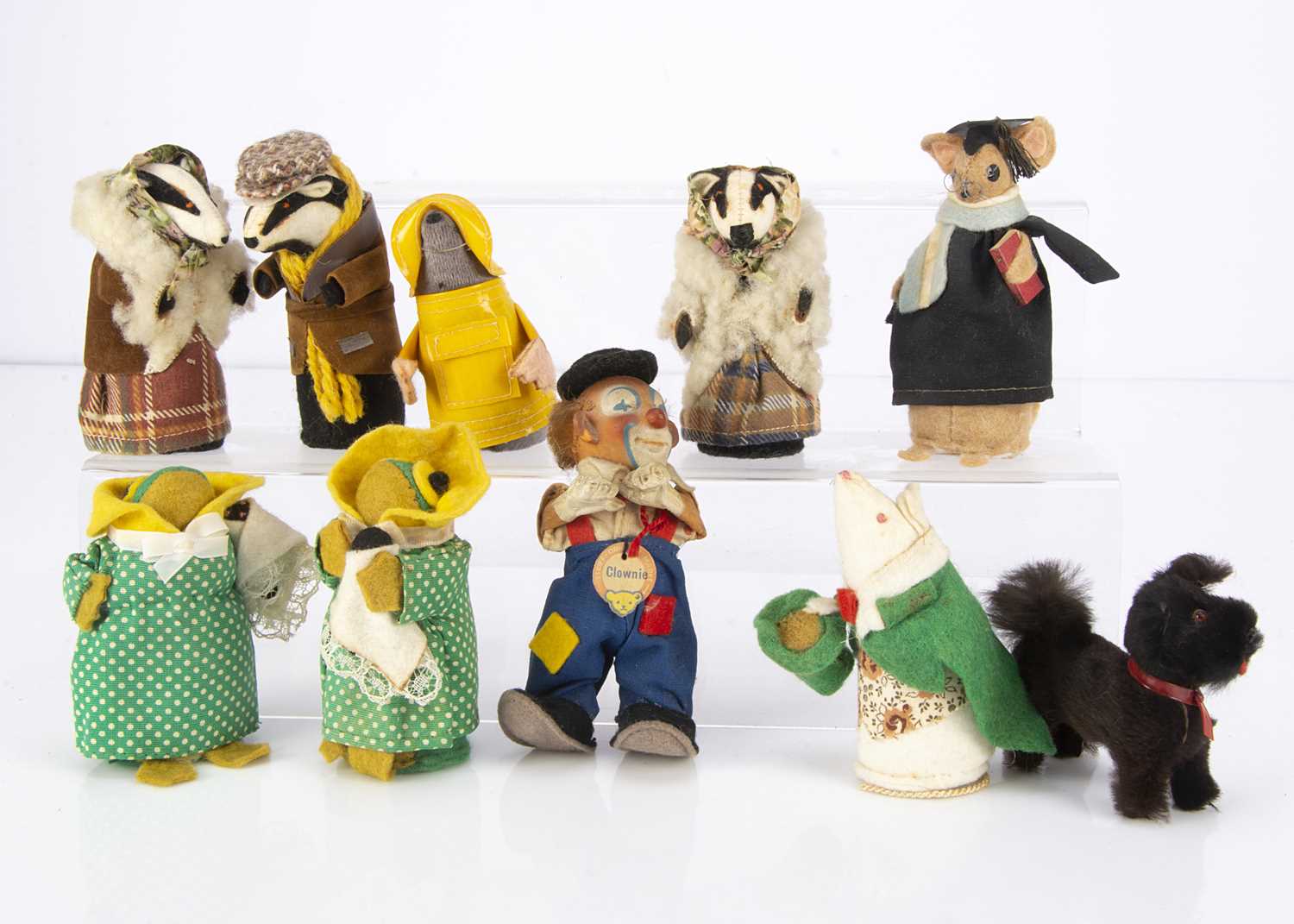 A collection of vintage soft toy animals, including three badgers, two ...