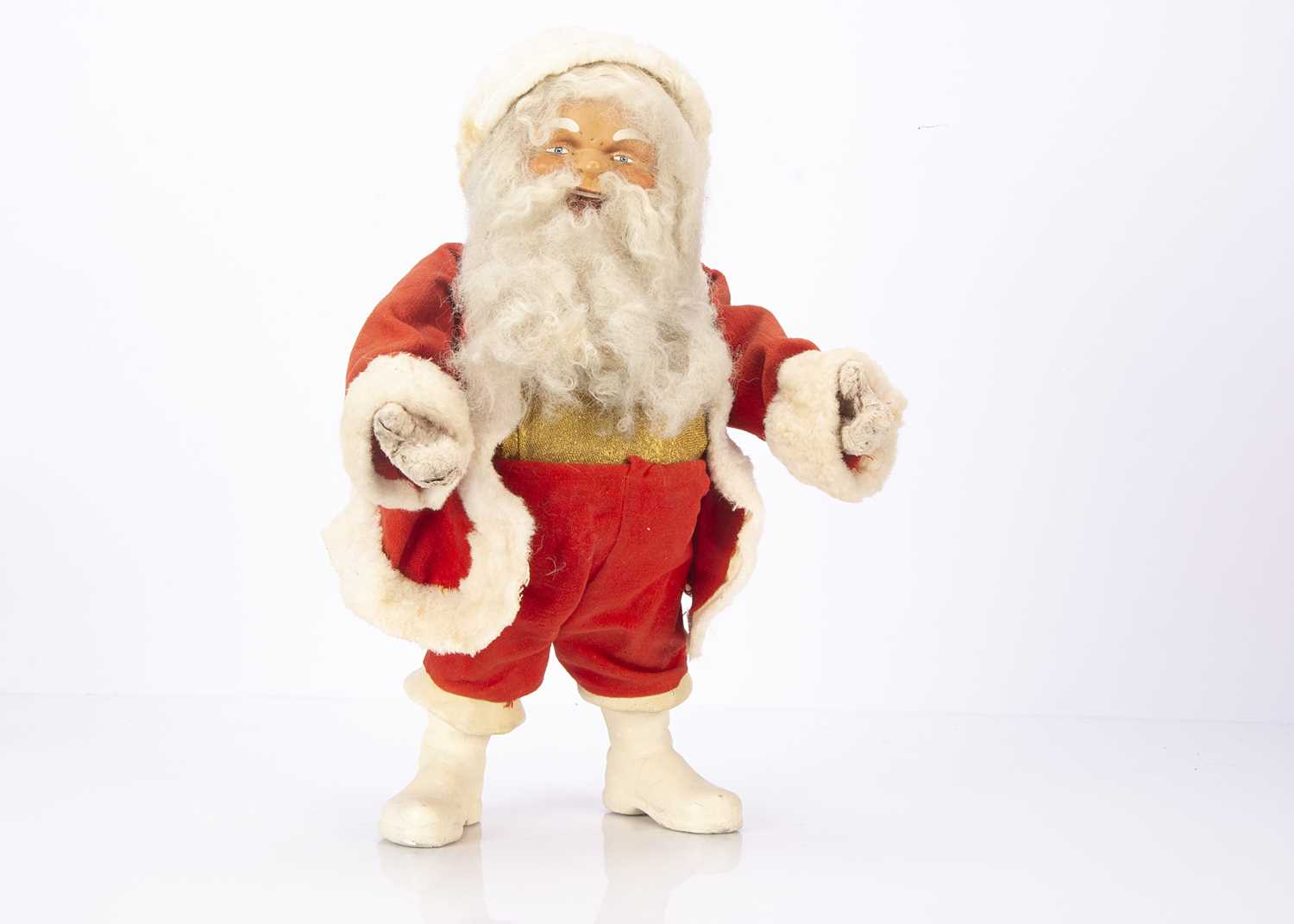 A post-war German clockwork shop window nodding Father Christmas, with ...
