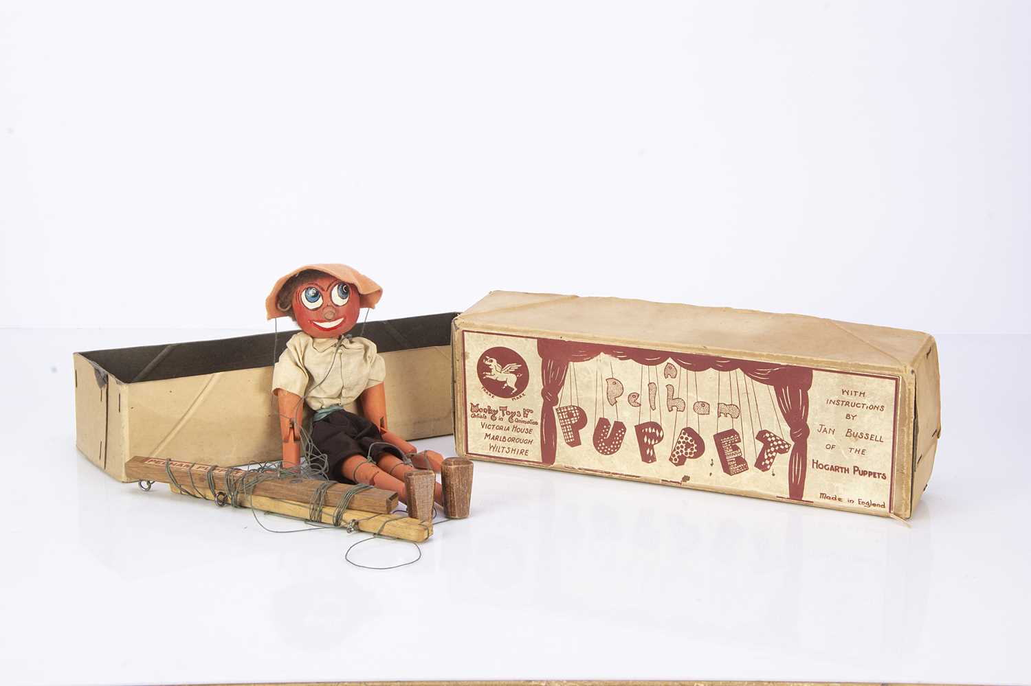 A rare Pelham Wonky Toy Man string puppet, with large googly blue ...