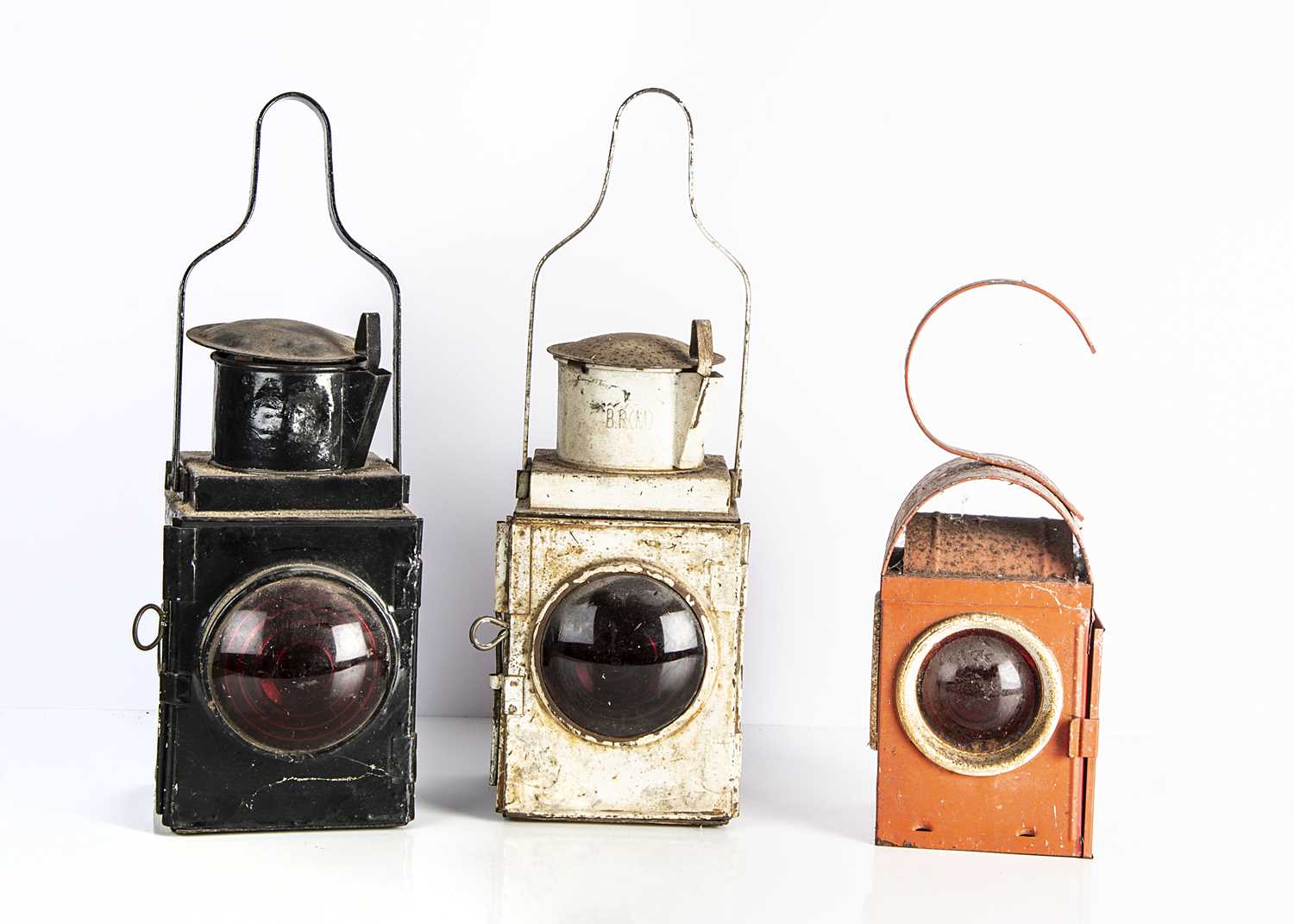 Two Railway Lamps and A Dibben Road Lamp, all of square form, white ...