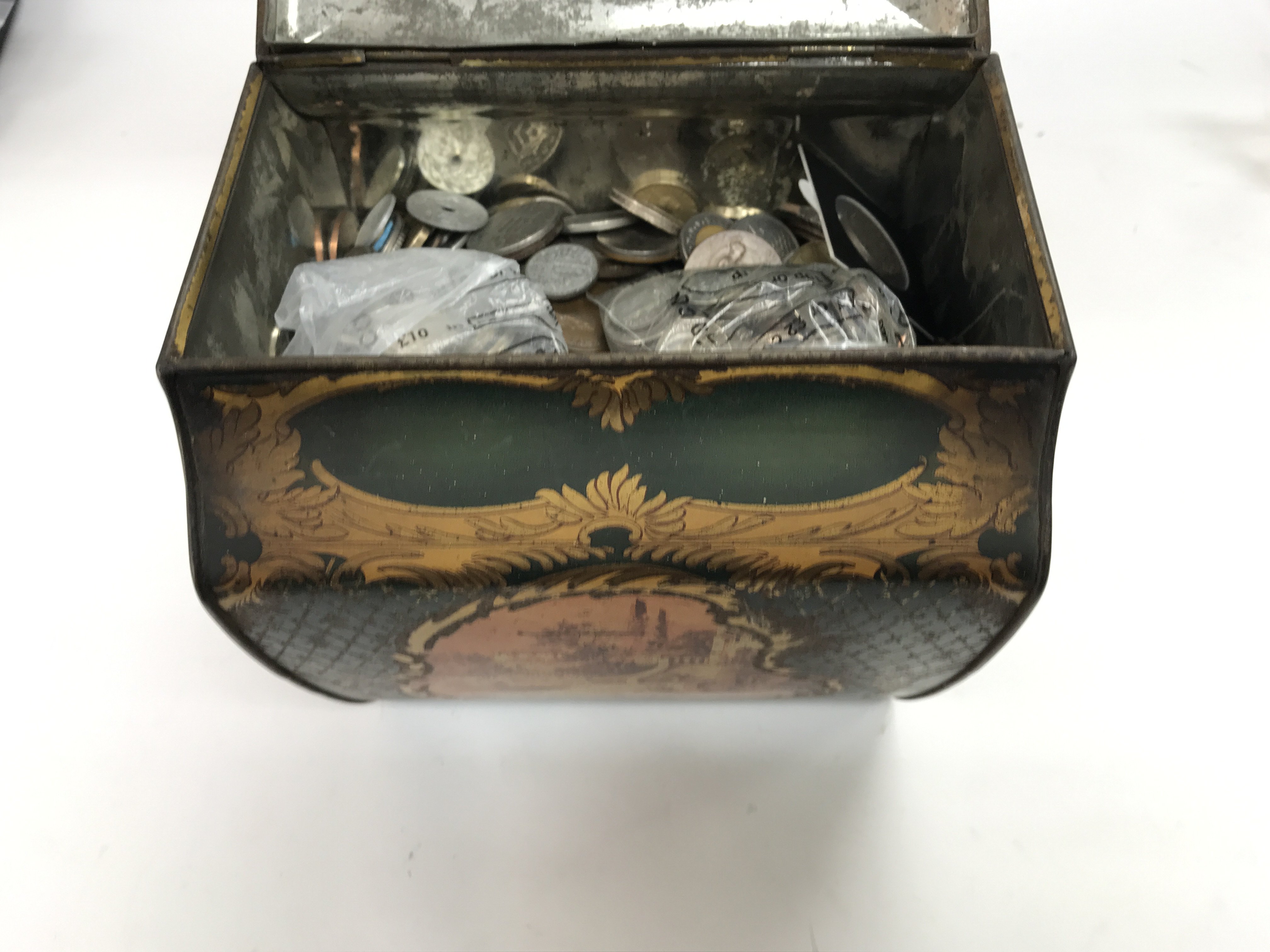 A tin of mixed coins