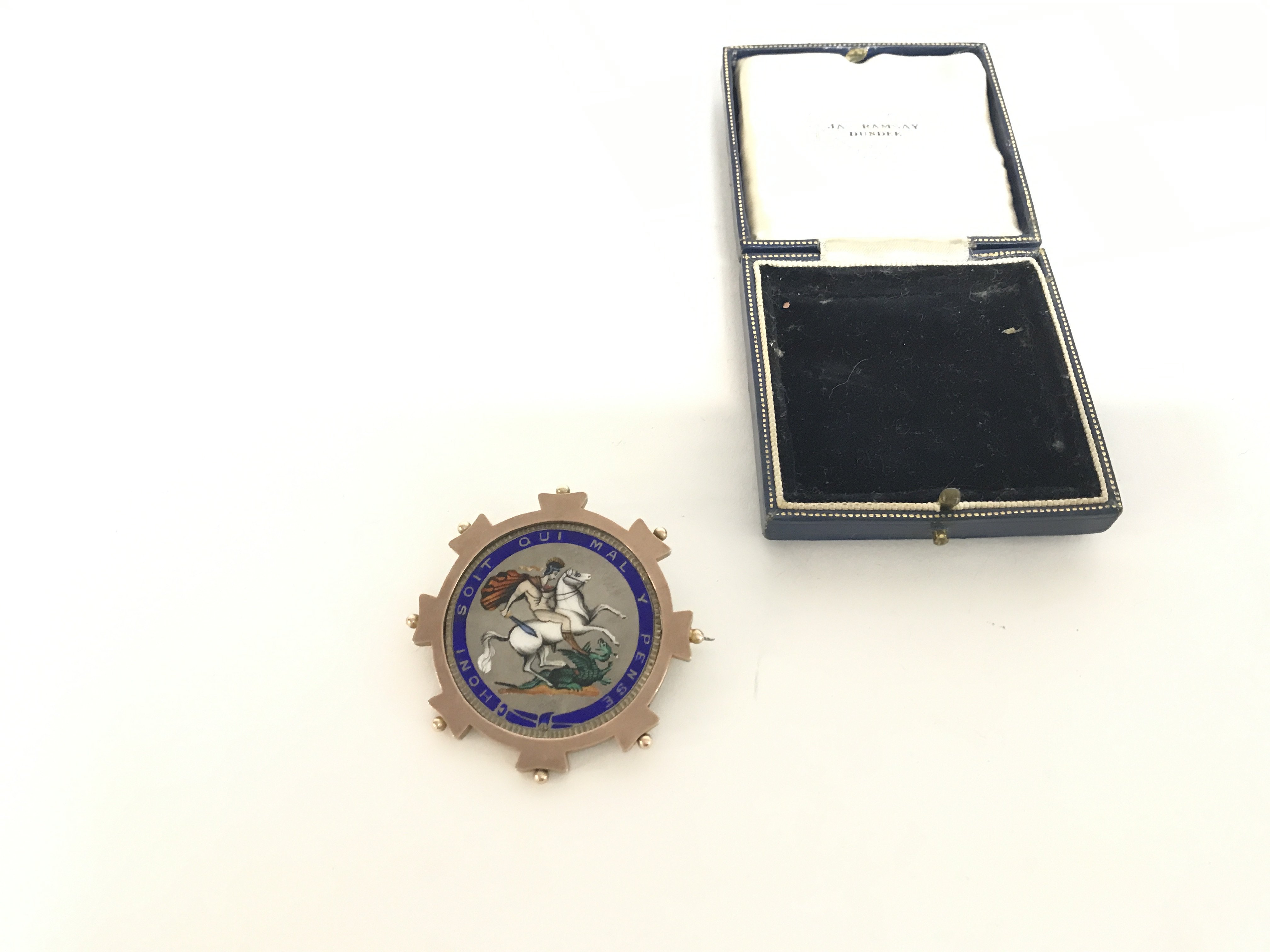 A silver coin mounted brooch.