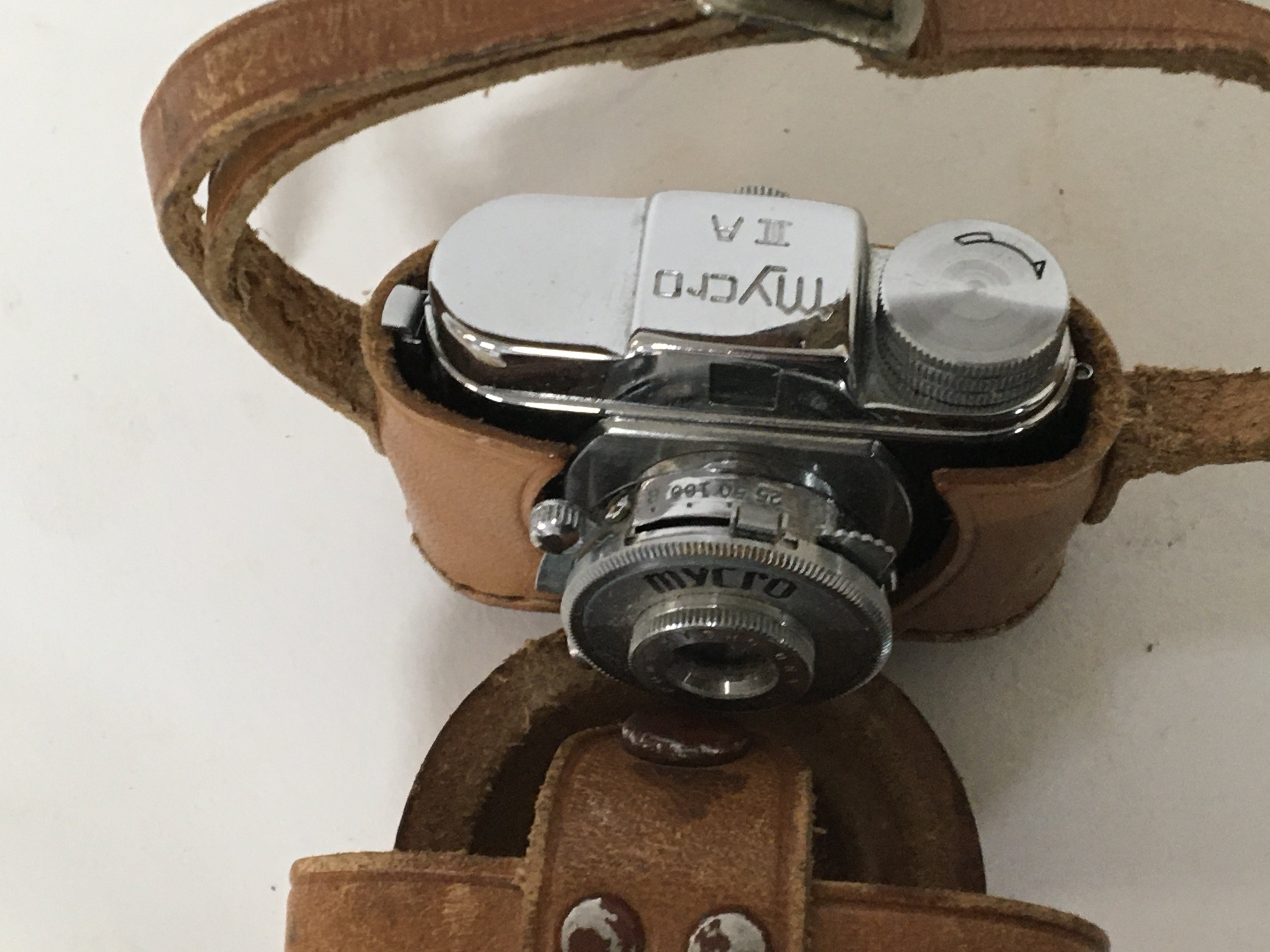 A miniature Mycro camera in a fitted leather case