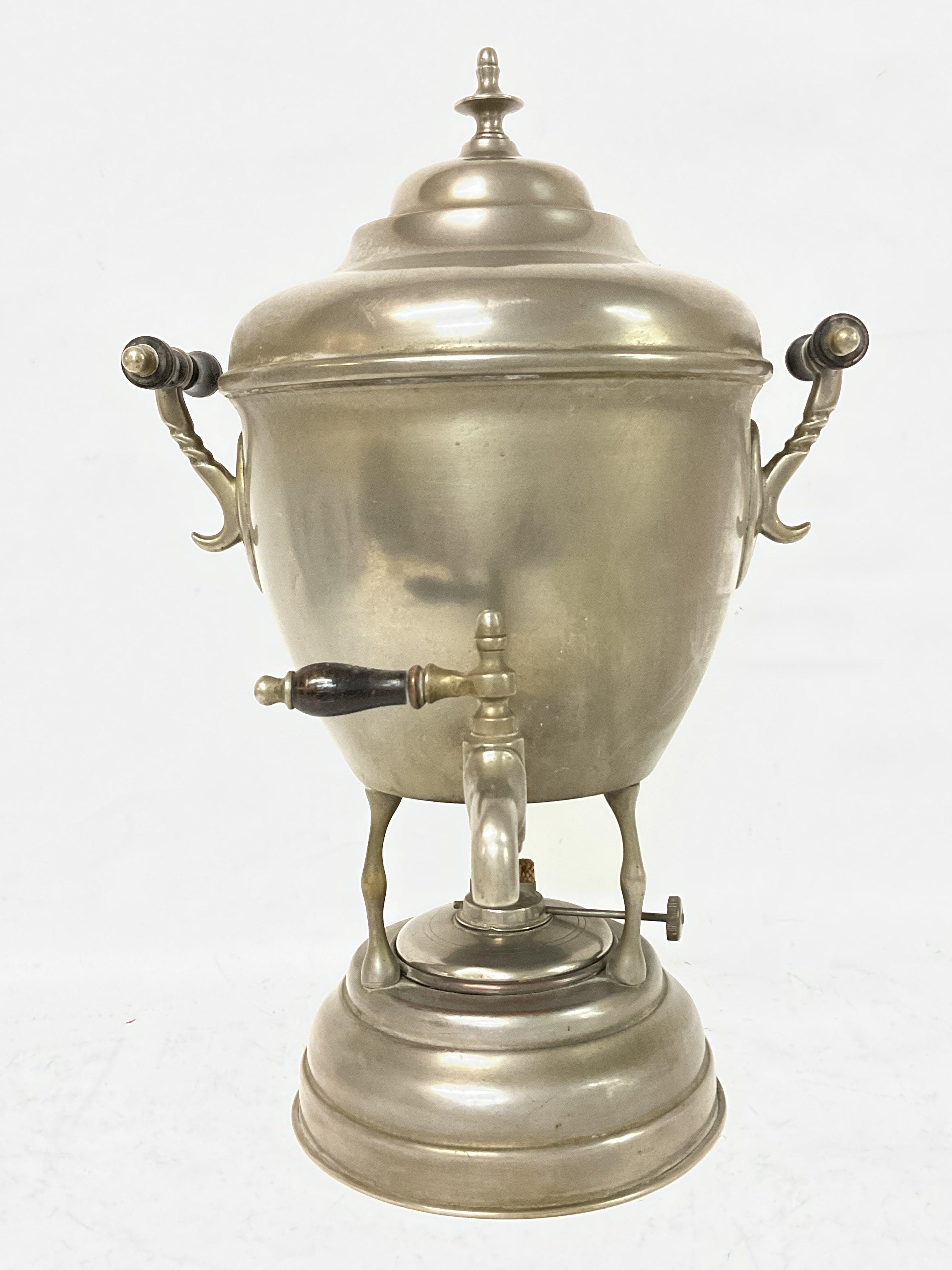 Victorian metal tea urn with tap and burner, approximately 42cm tall.