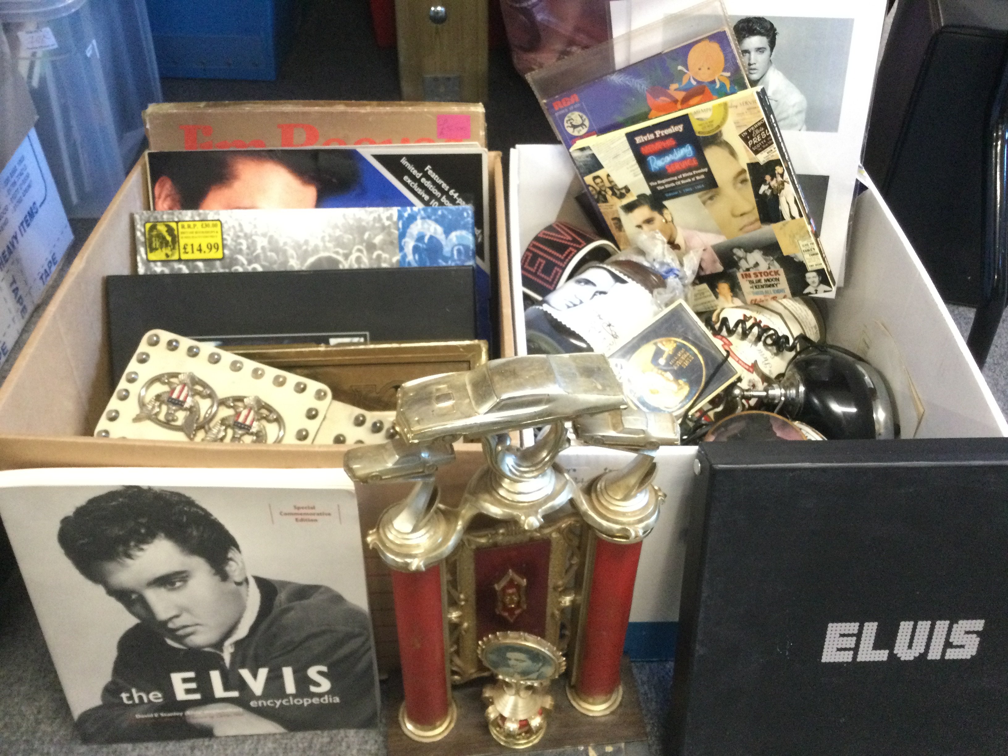 Four boxes of Elvis Presley memorabilia comprising postcards, ceramics ...