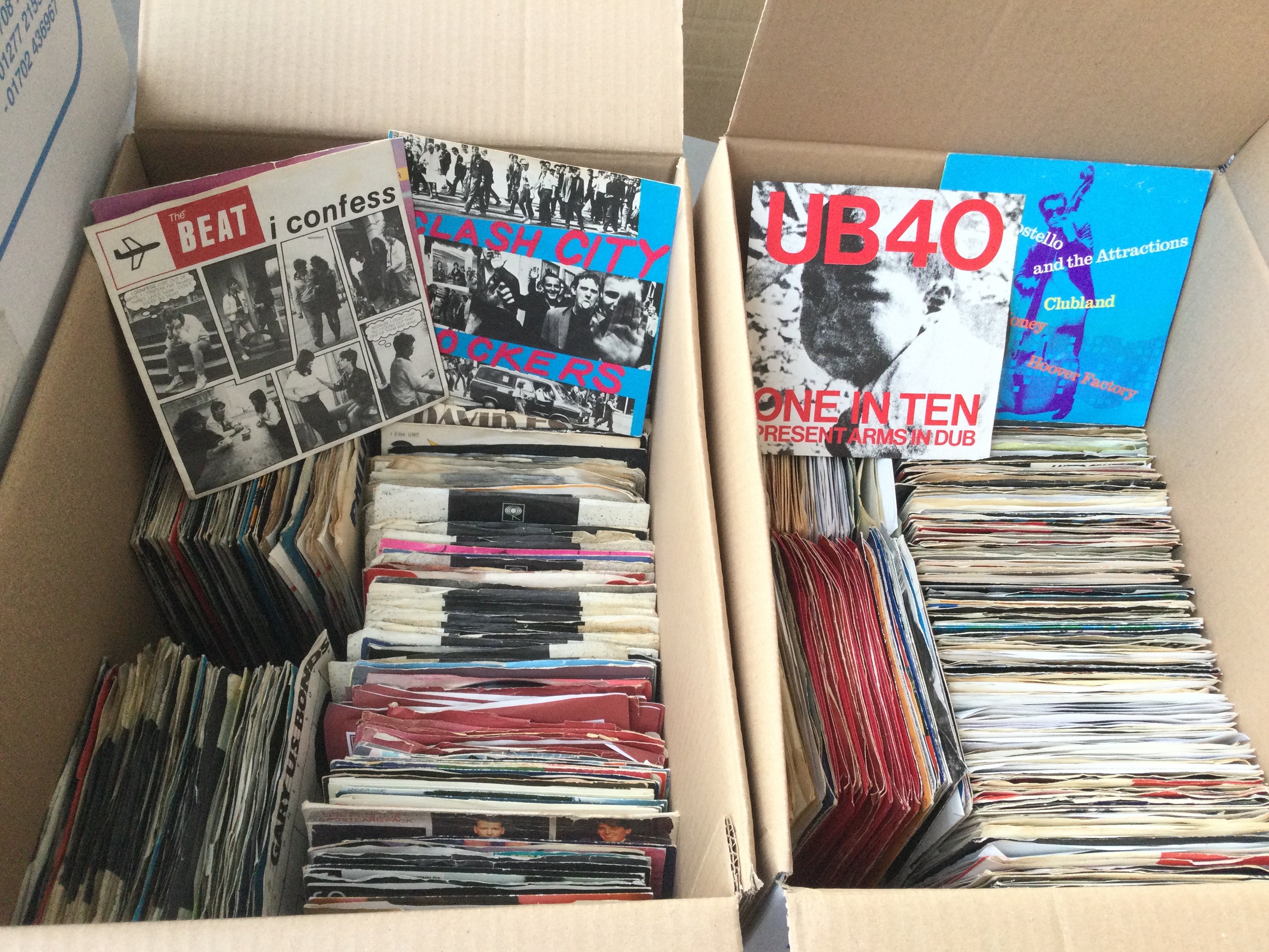 Two boxes of 7inch singles by various artists including David Bowie ...
