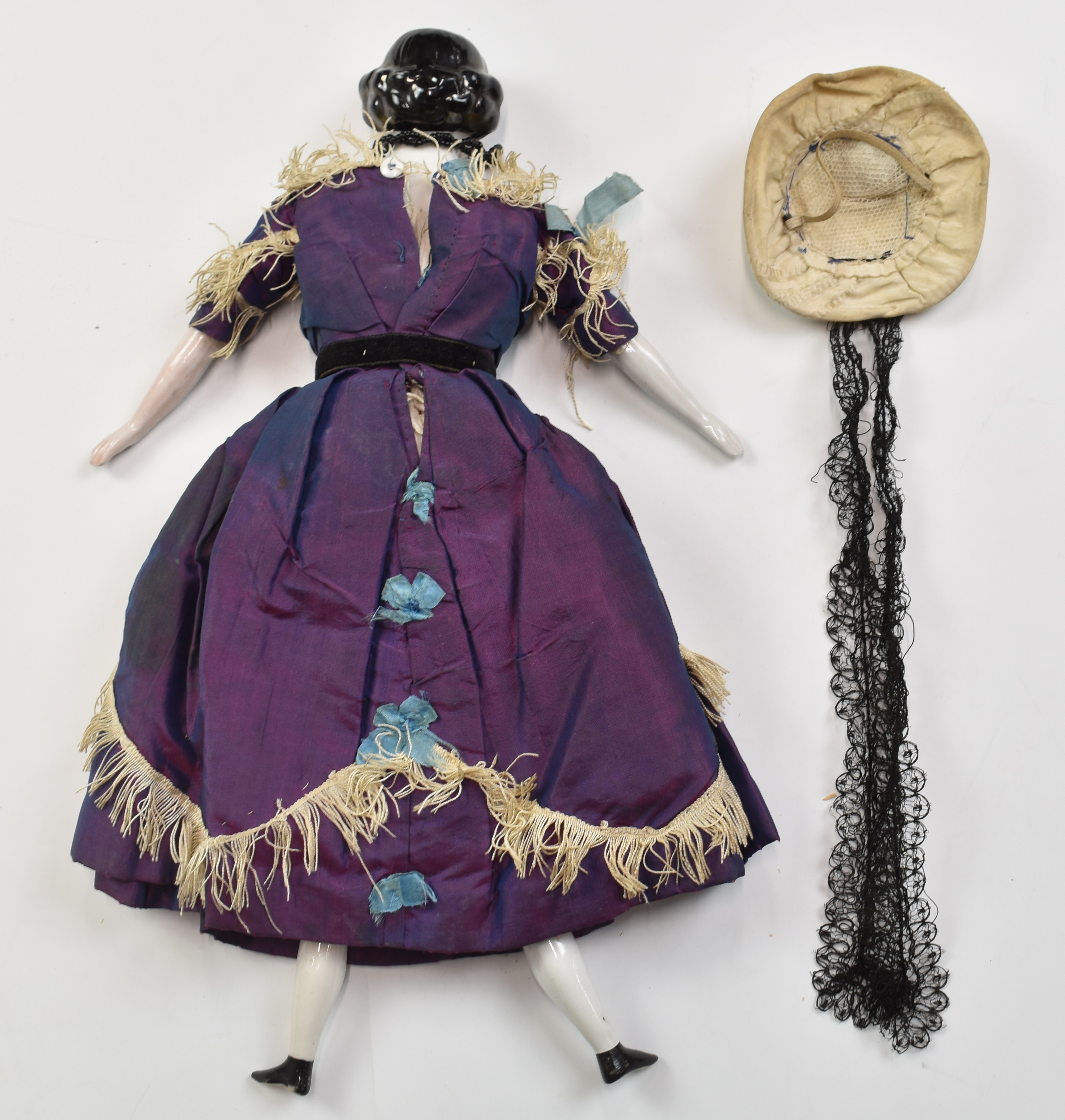 19th / early 20thC German porcelain doll wearing period purple silk ...
