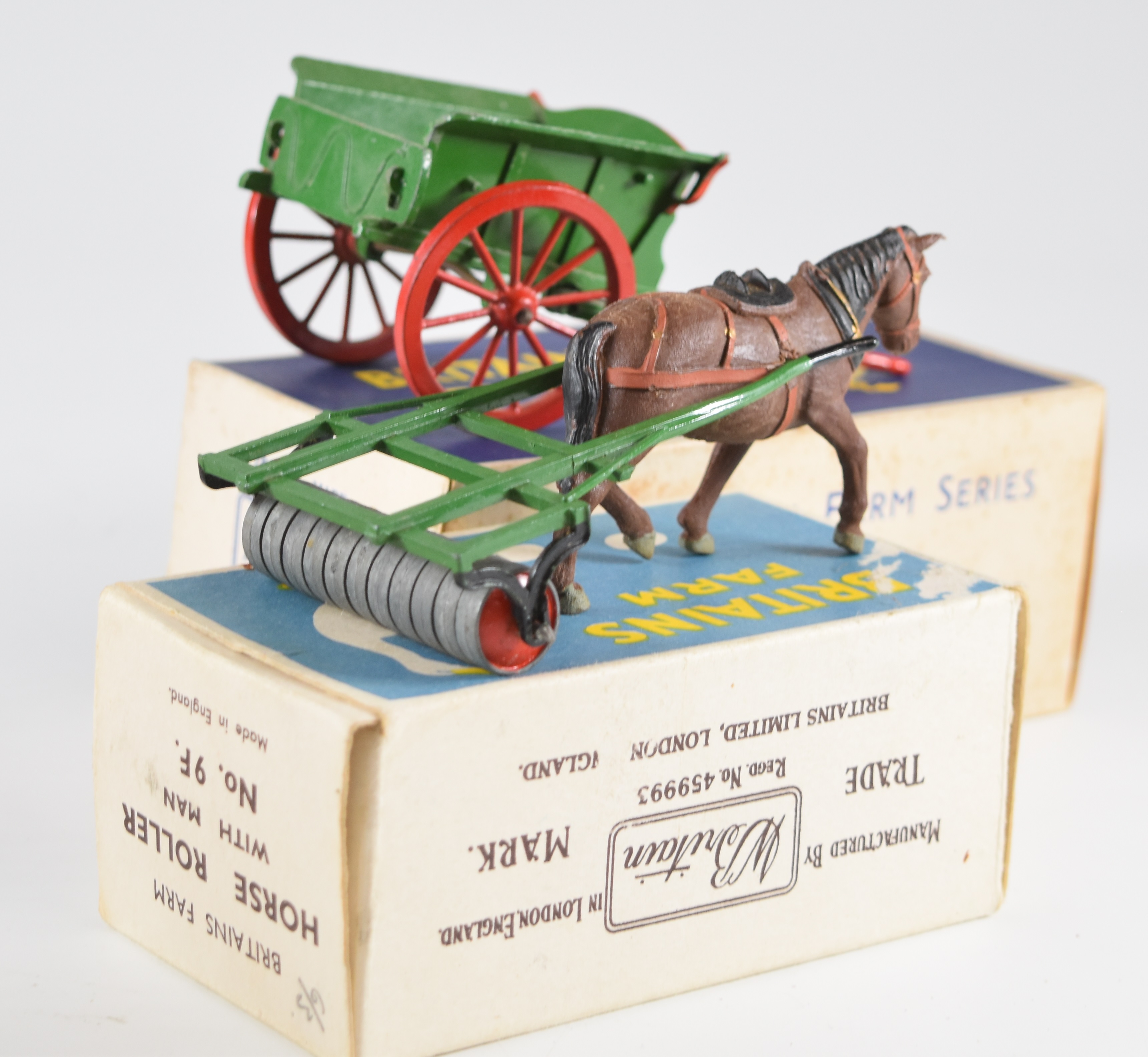 Three diecast model farm vehicles comprising Britains Farm Horse Rake ...
