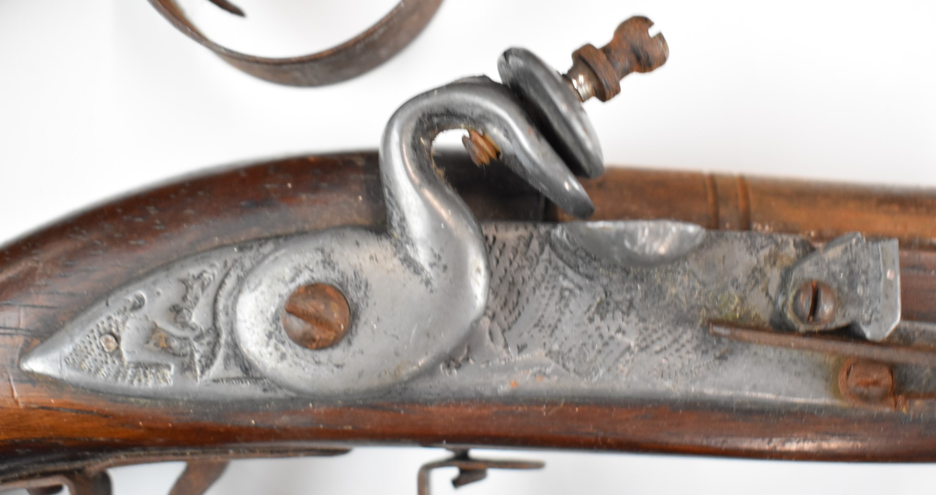 Three decorative flintlock pistols, two with lion mask butt caps ...