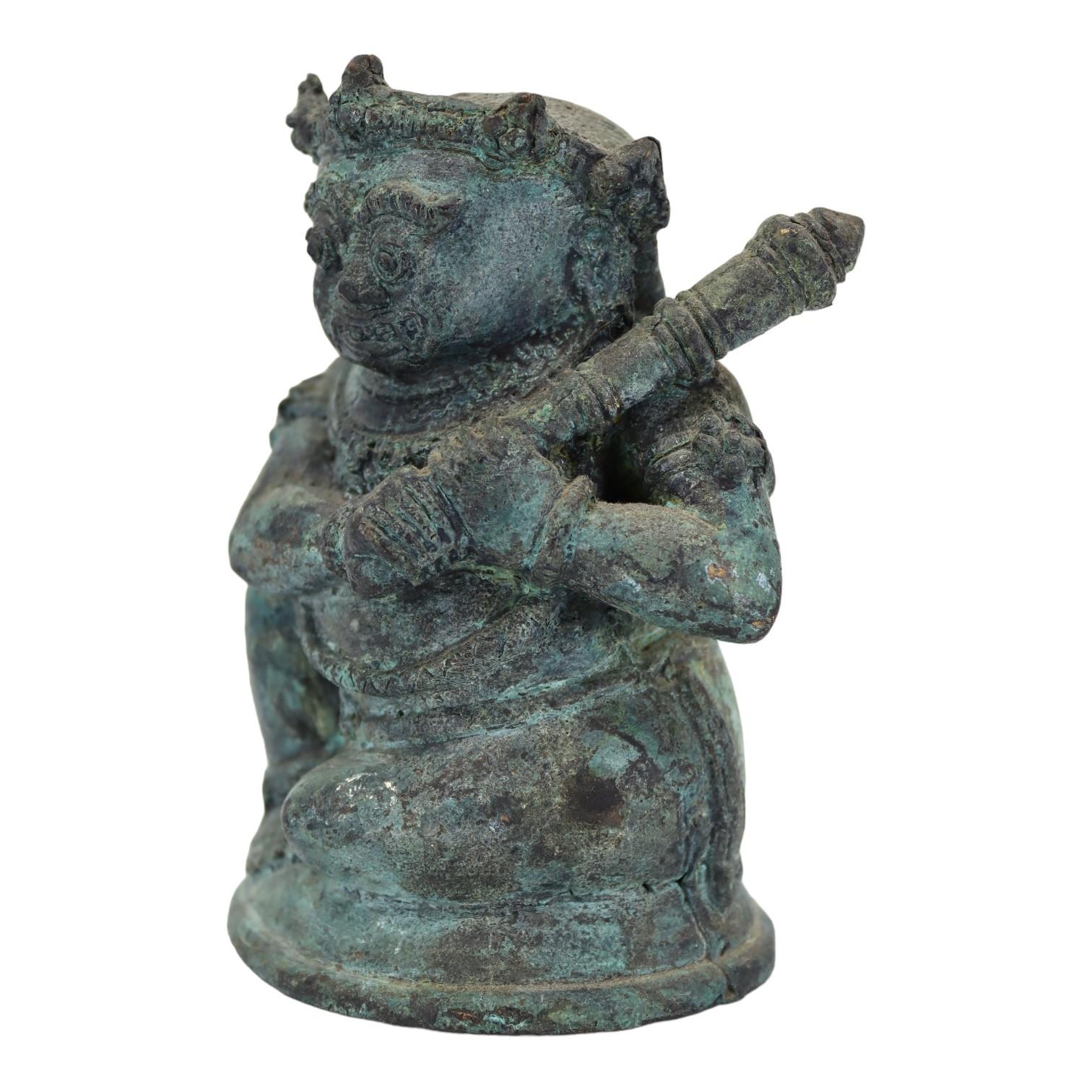 AN INDONESIAN, JAVANESE FIGURE OF BATHARA KALA/BHOMAHolding a gada ...
