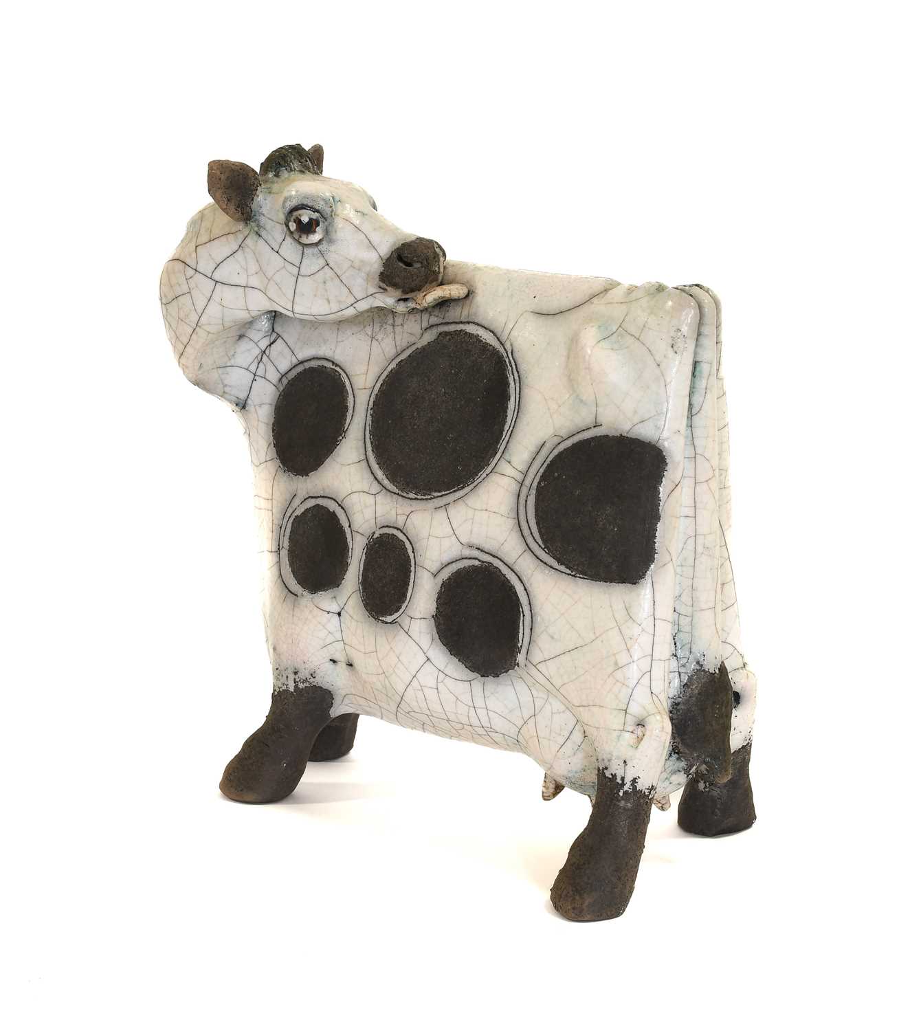 Lawson E Rudge (b.1936): A Raku Pottery Licking Flat Cow, spot pattern ...