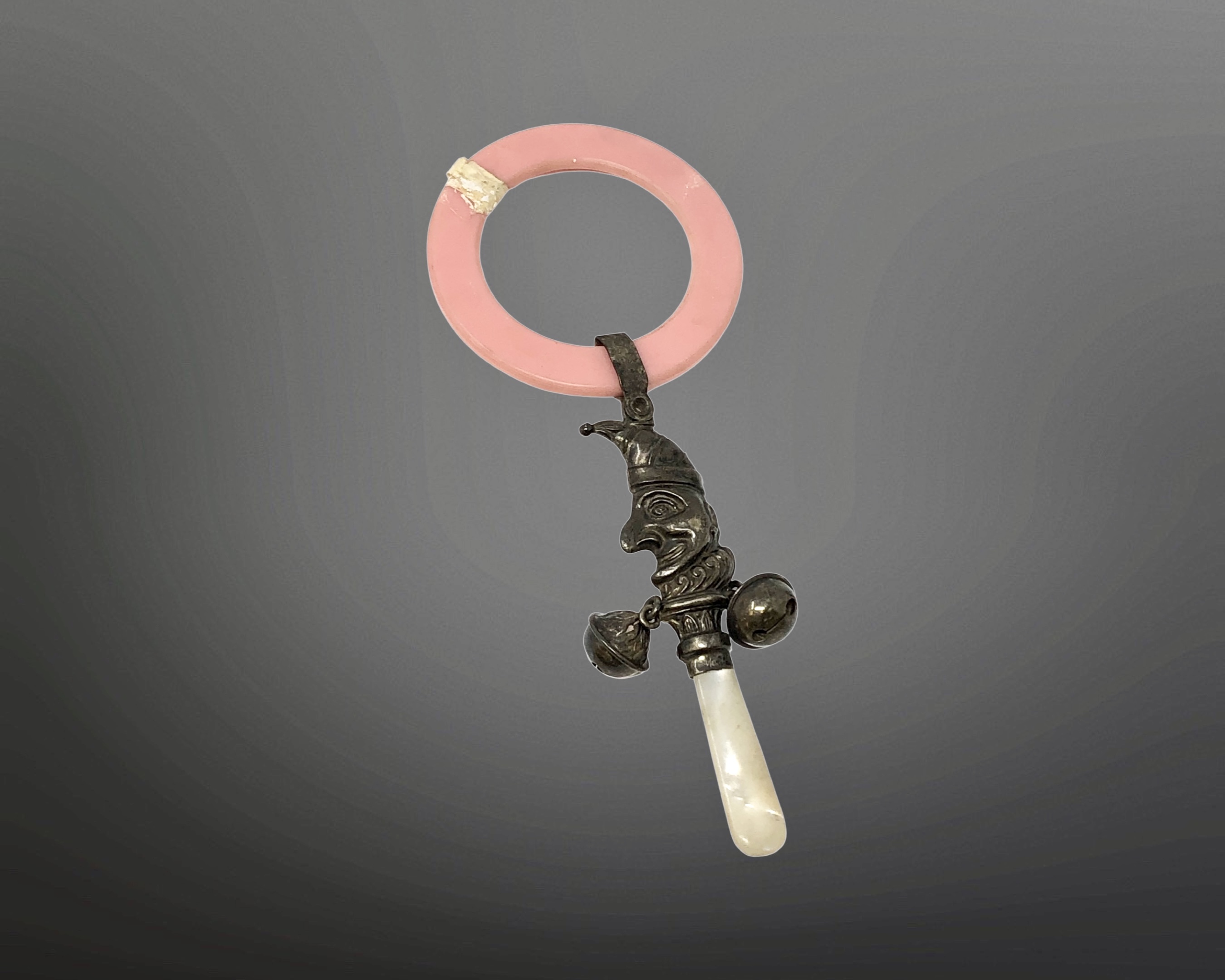 A silver rattle and teething ring modelled as Mr. Punch, Birmingham 1926