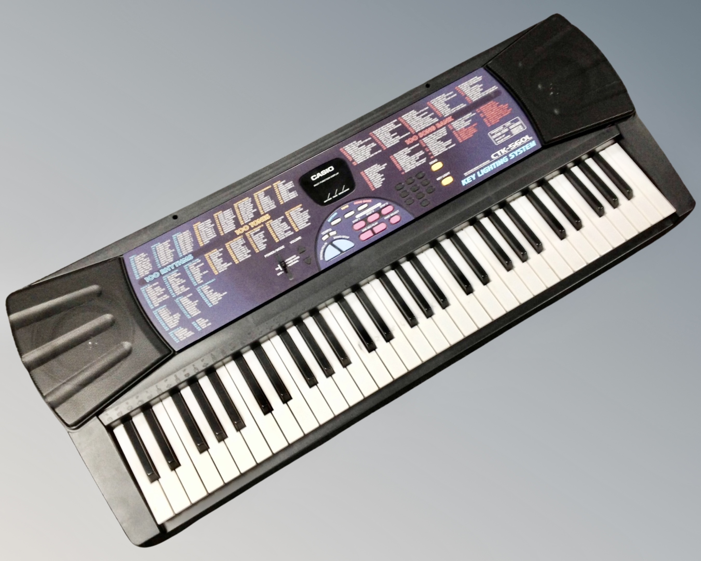 A Casio CTK-560 L electric keyboard together with three cameras, Halina ...