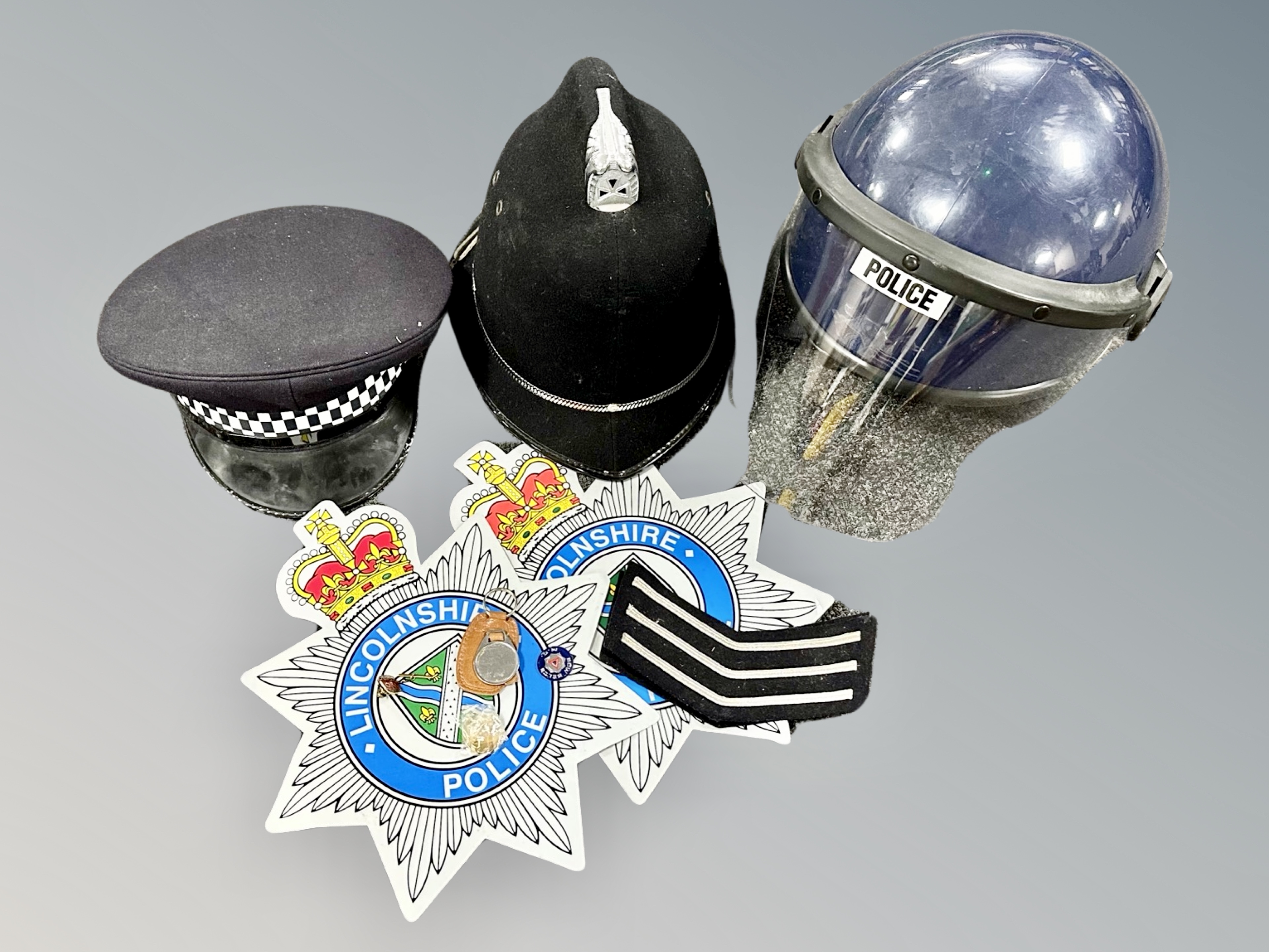 A Police hard hat, Cap, Riot helmet etc