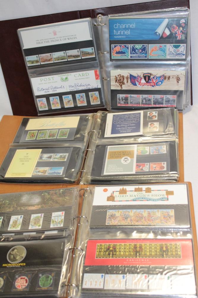 Three albums containing a collection of over 180 GB stamp presentation ...