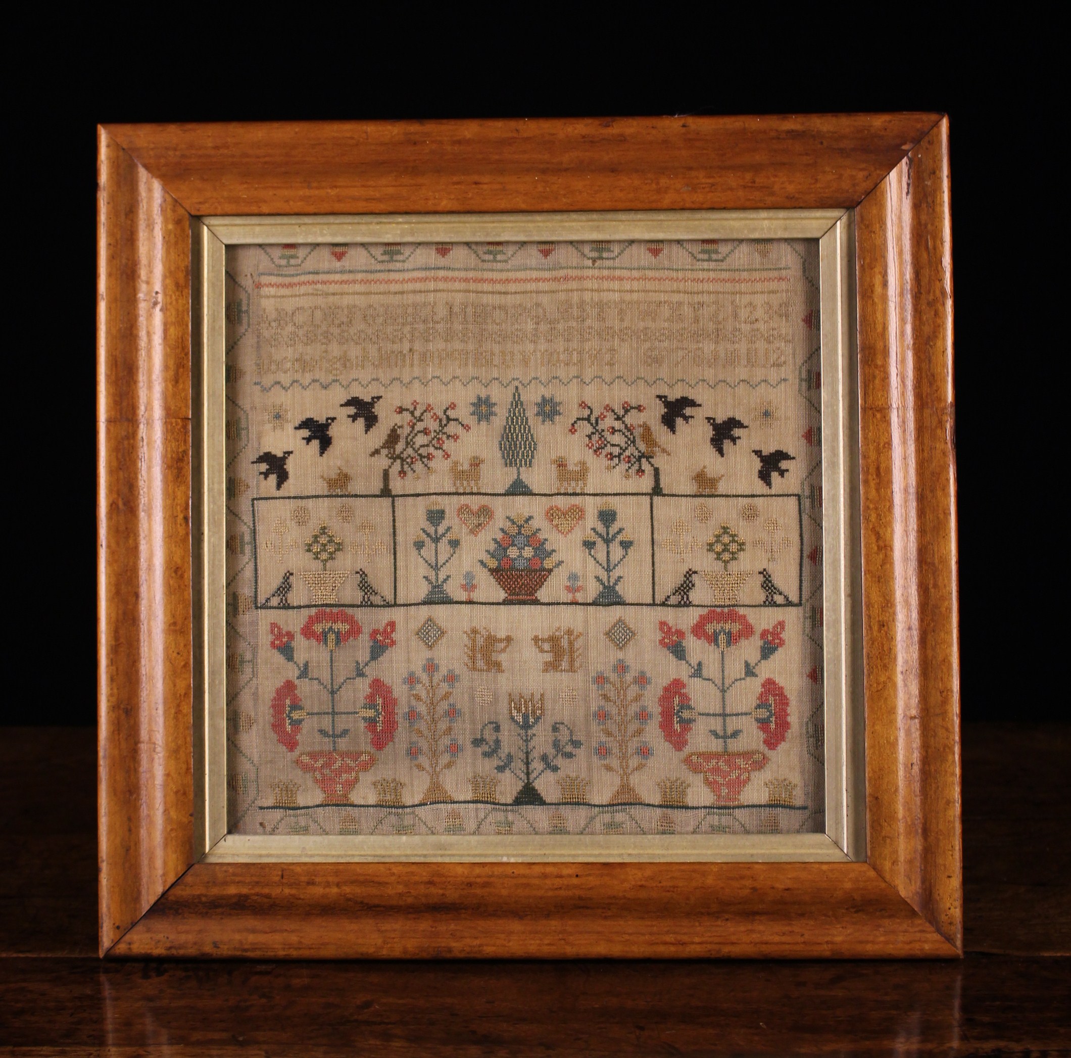 A Delightful 19th Century Sampler worked in coloured threads with ...